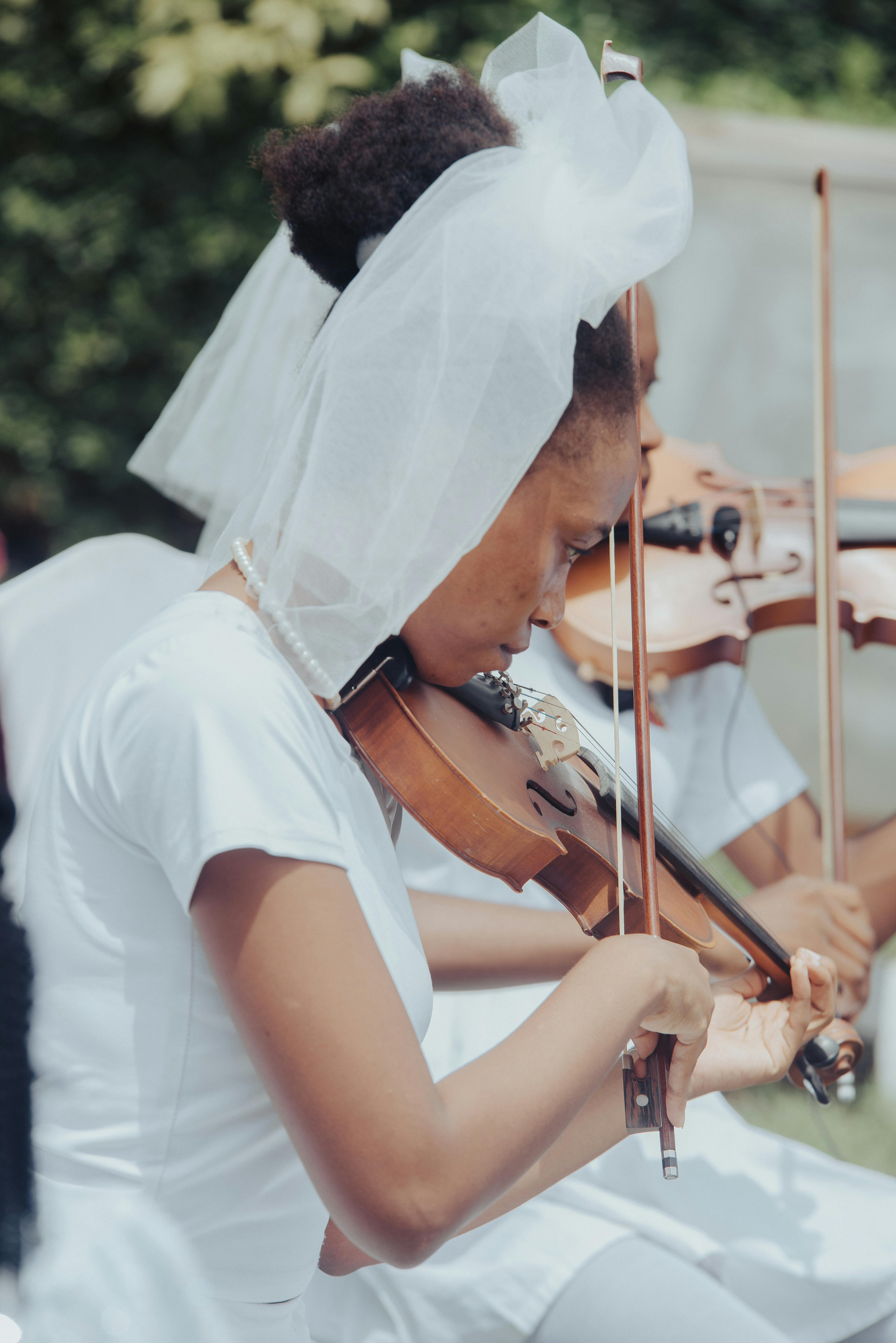 Bride Playing Violin at Outdoor Wedding in Nigeria · Free Stock Photo