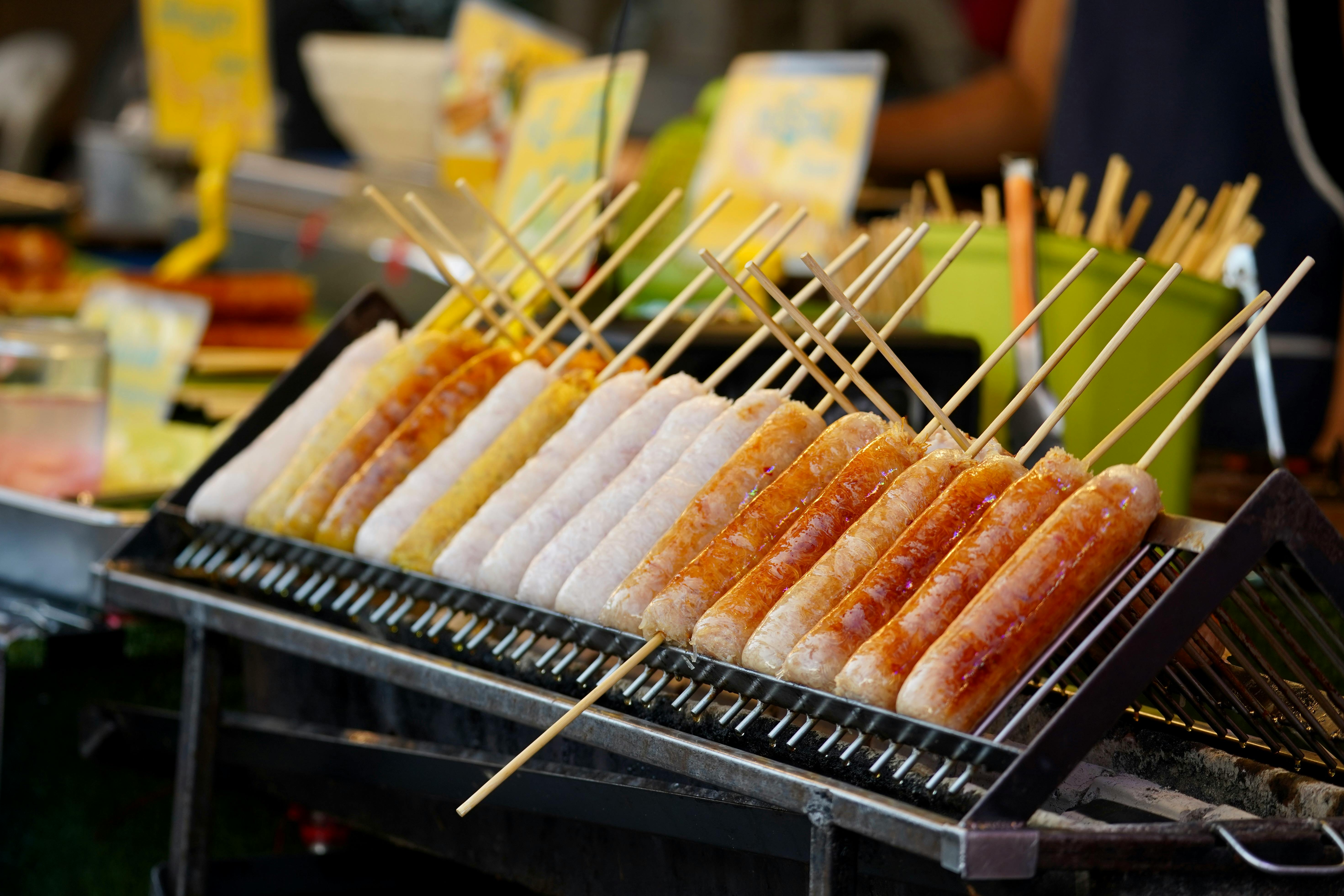 Tilt Shift Photography of Street Foods in Stick · Free Stock Photo