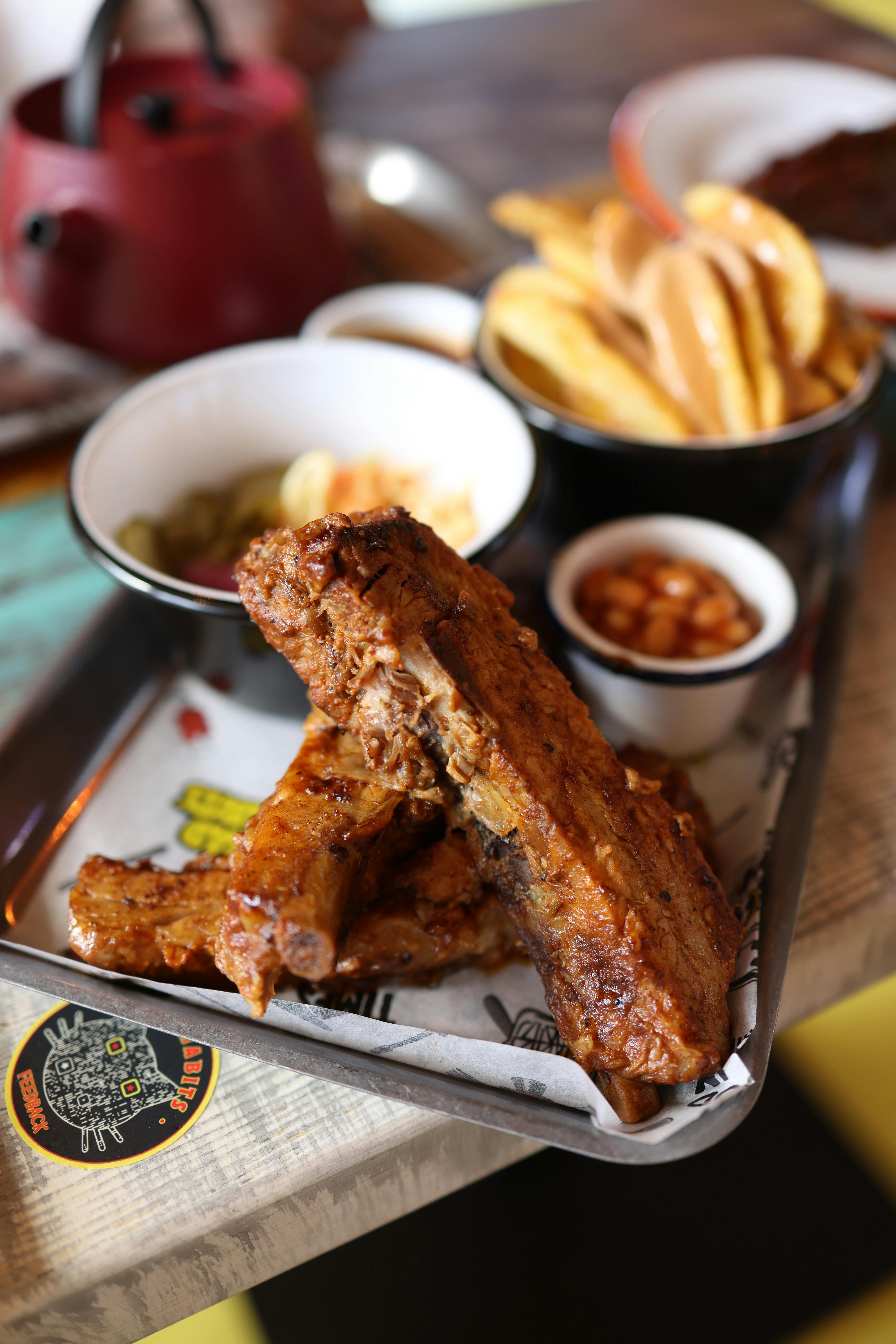 Close-up of BBQ Ribs with Sides on a Tray · Free Stock Photo