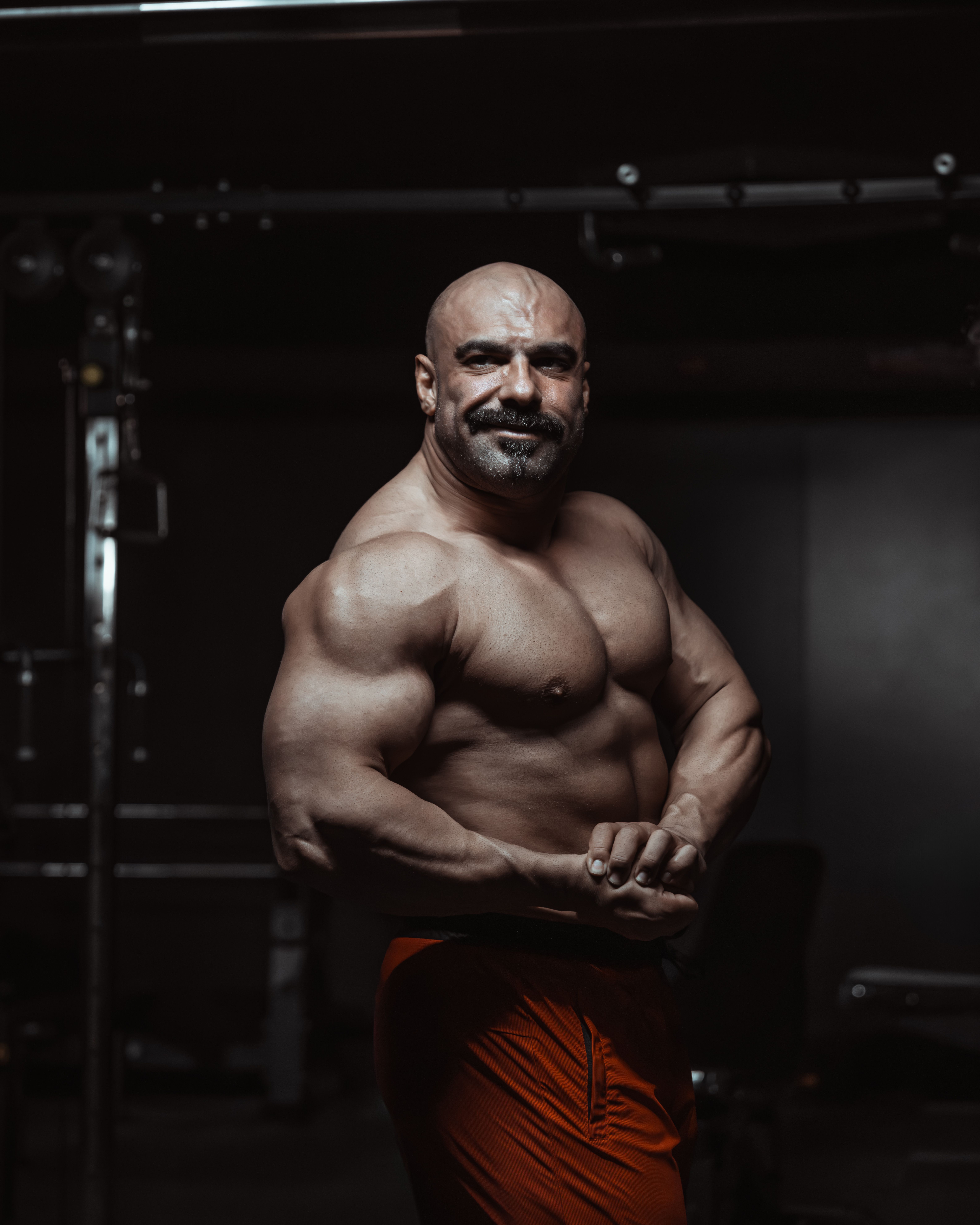 Muscular Male Bodybuilder Posing in Gym · Free Stock Photo