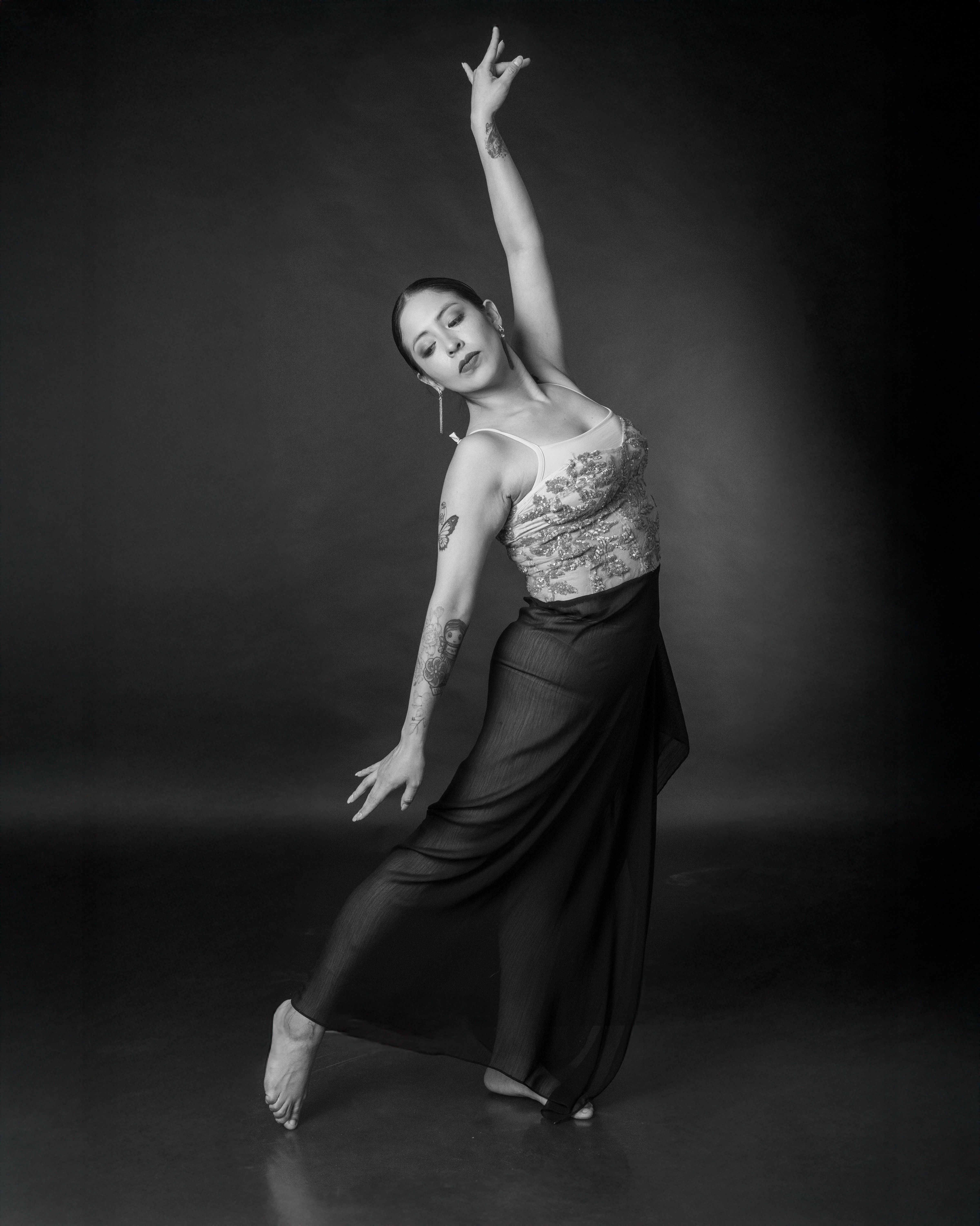 Elegant Latina Dancer in Graceful Pose · Free Stock Photo