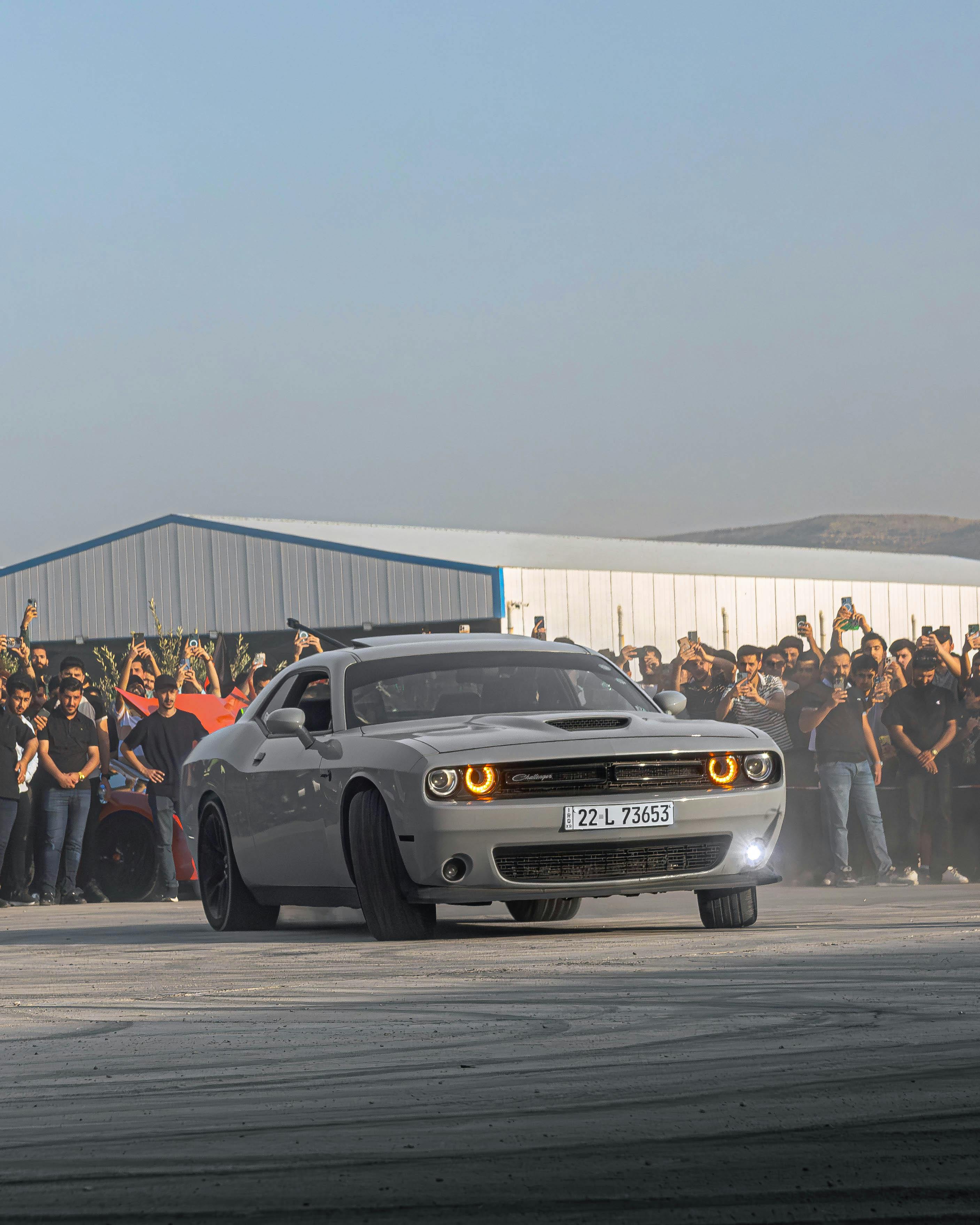 Drifting Dodge Challenger in Exciting Car Event · Free Stock Photo