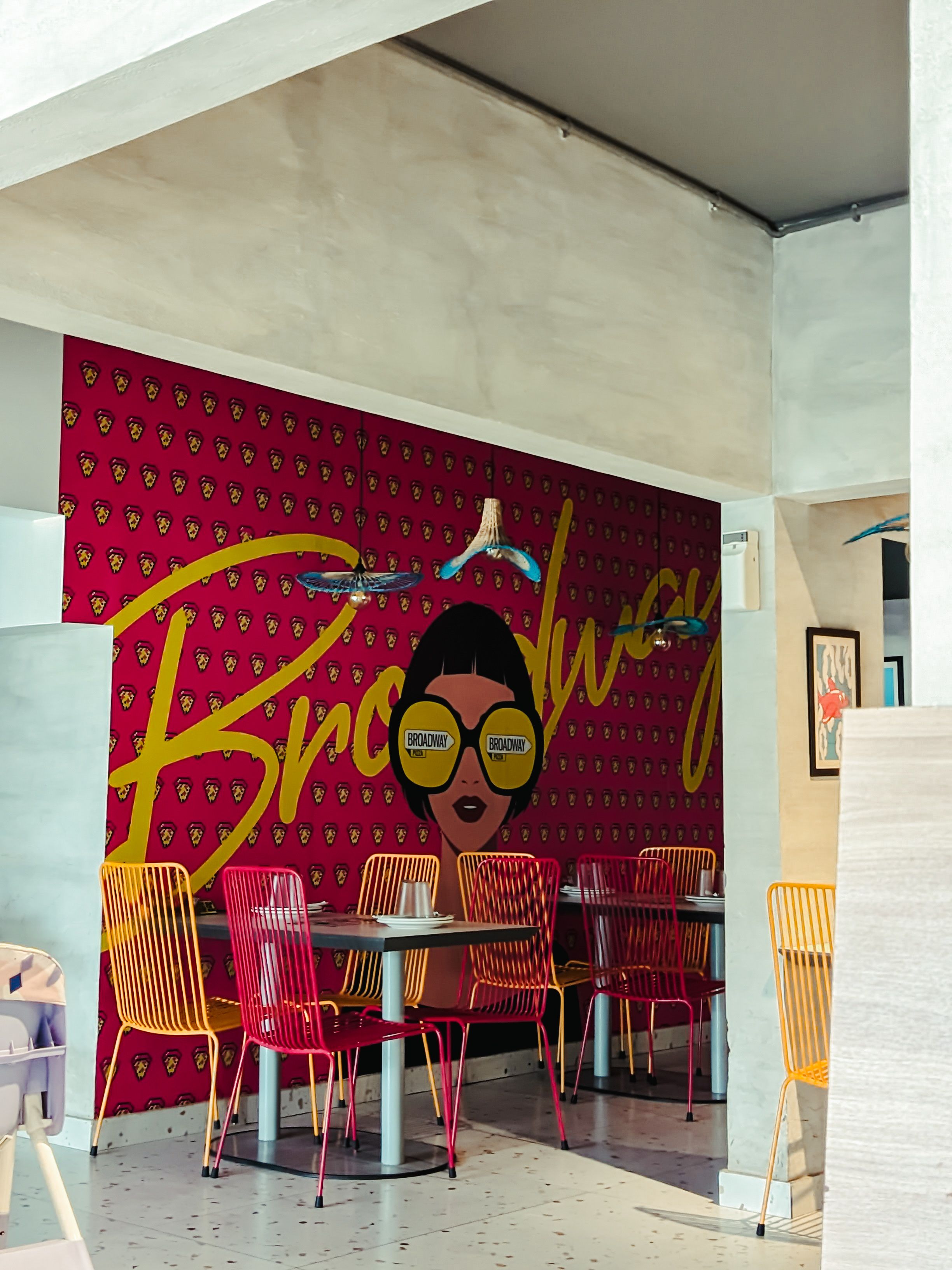 Vibrant Café Interior with Artistic Wall Mural · Free Stock Photo