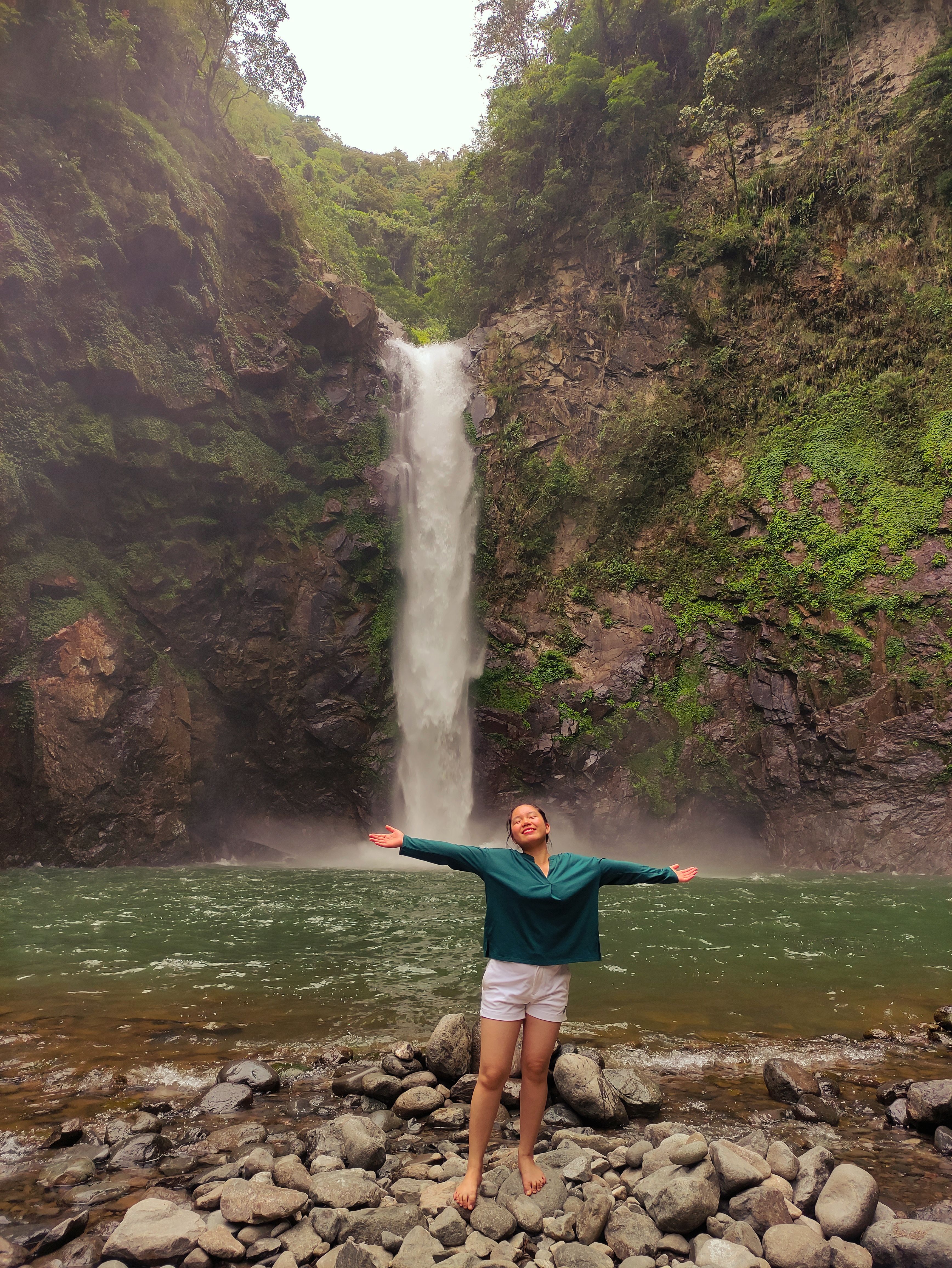 Joyful Person by Scenic Waterfall in Banaue · Free Stock Photo