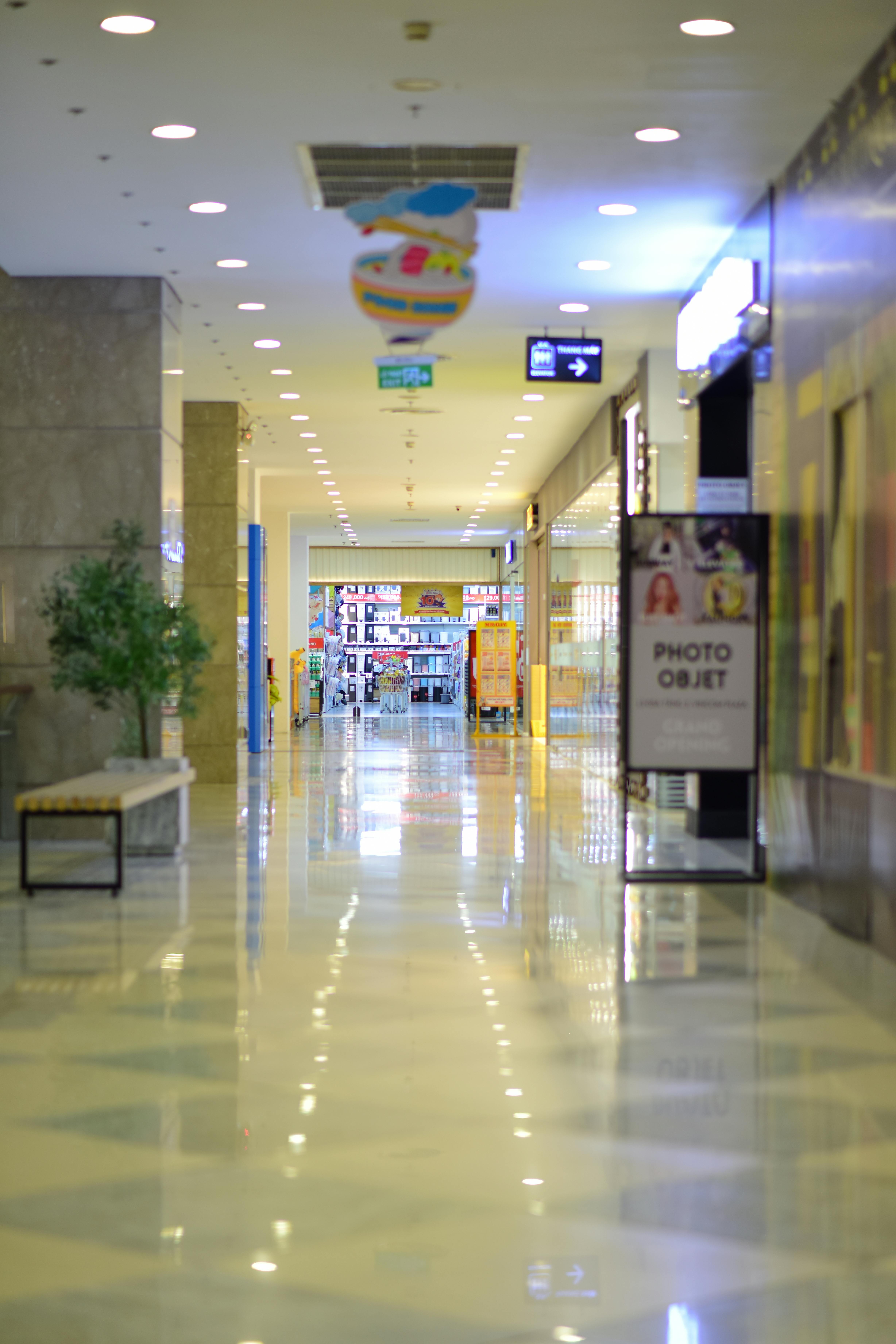 Empty Shopping Mall Corridor with Bright Lighting · Free Stock Photo