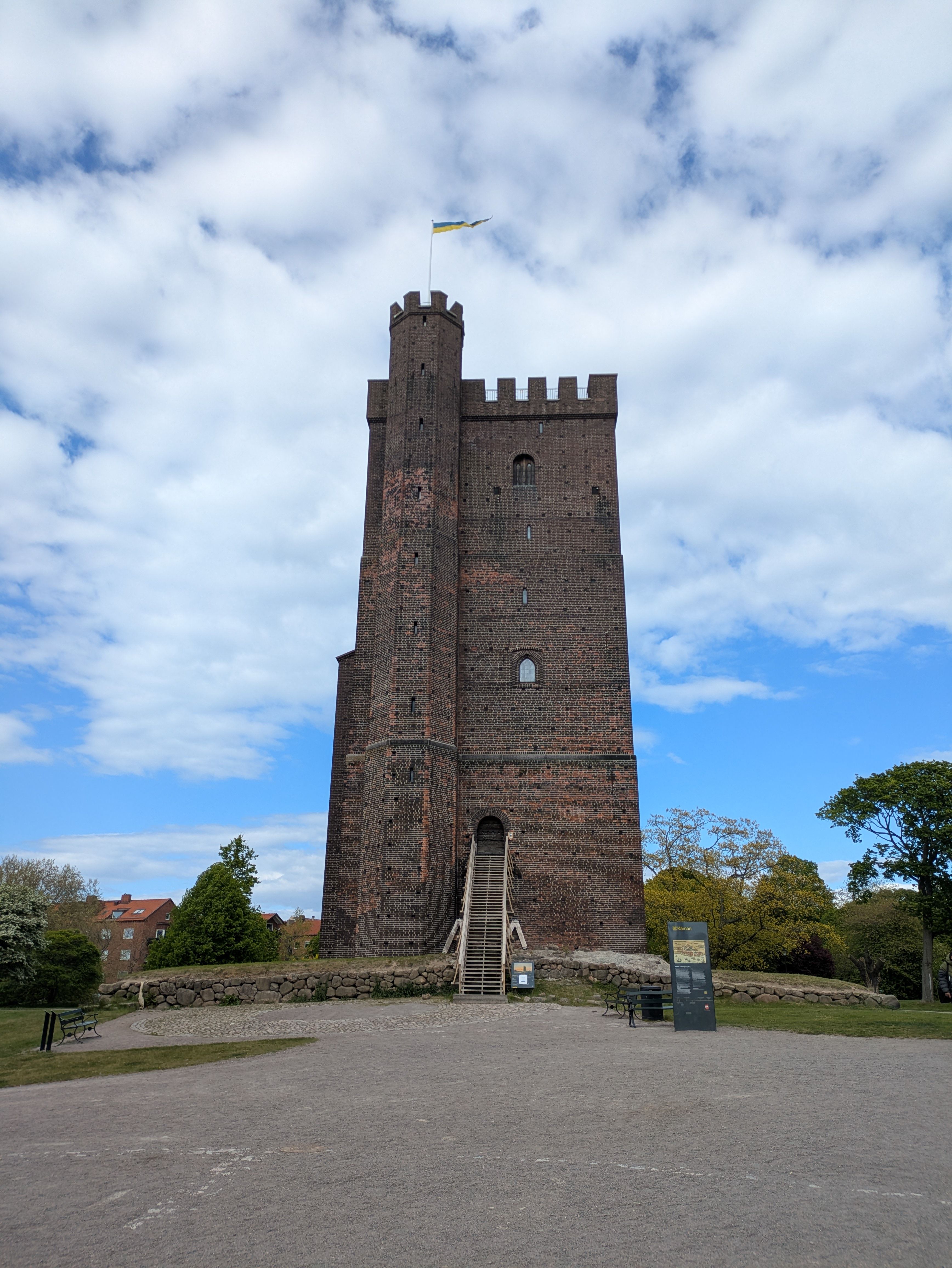 Magnificent Medieval Brick Tower Against Blue Sky · Free Stock Photo