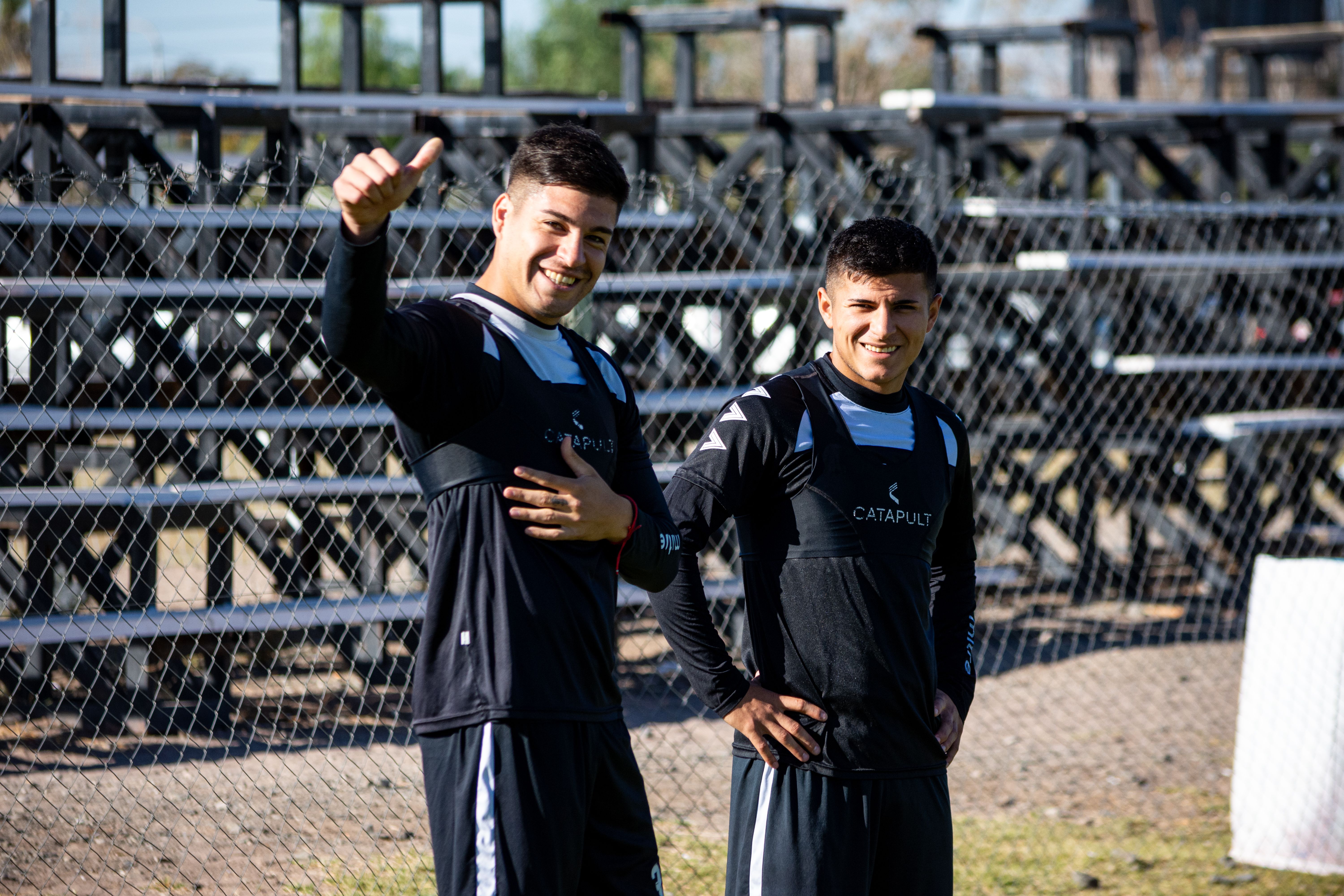 Young Athletes Smiling During Outdoor Soccer Practice · Free Stock Photo
