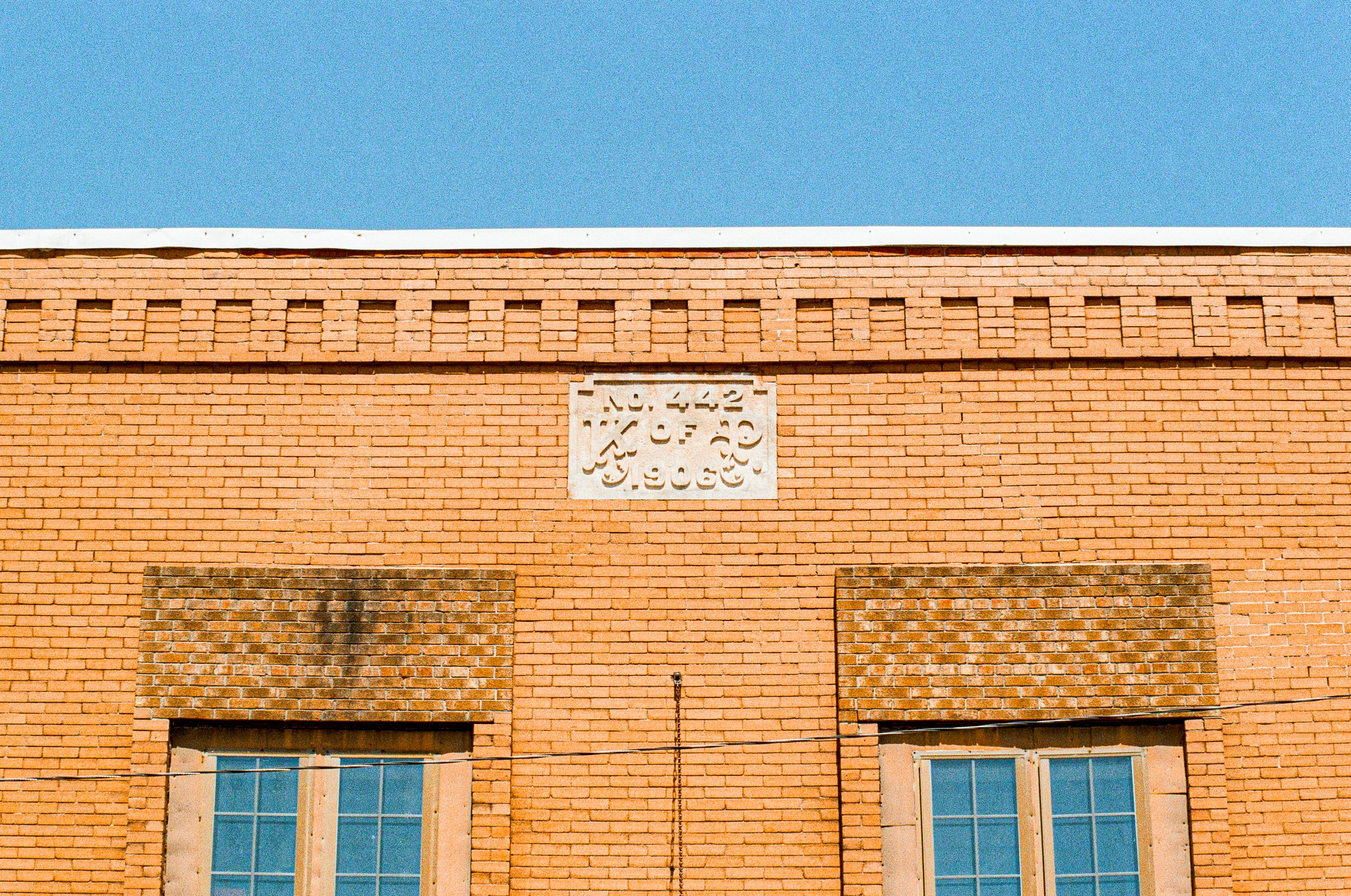 Vintage Brick Building with Architectural Details · Free Stock Photo