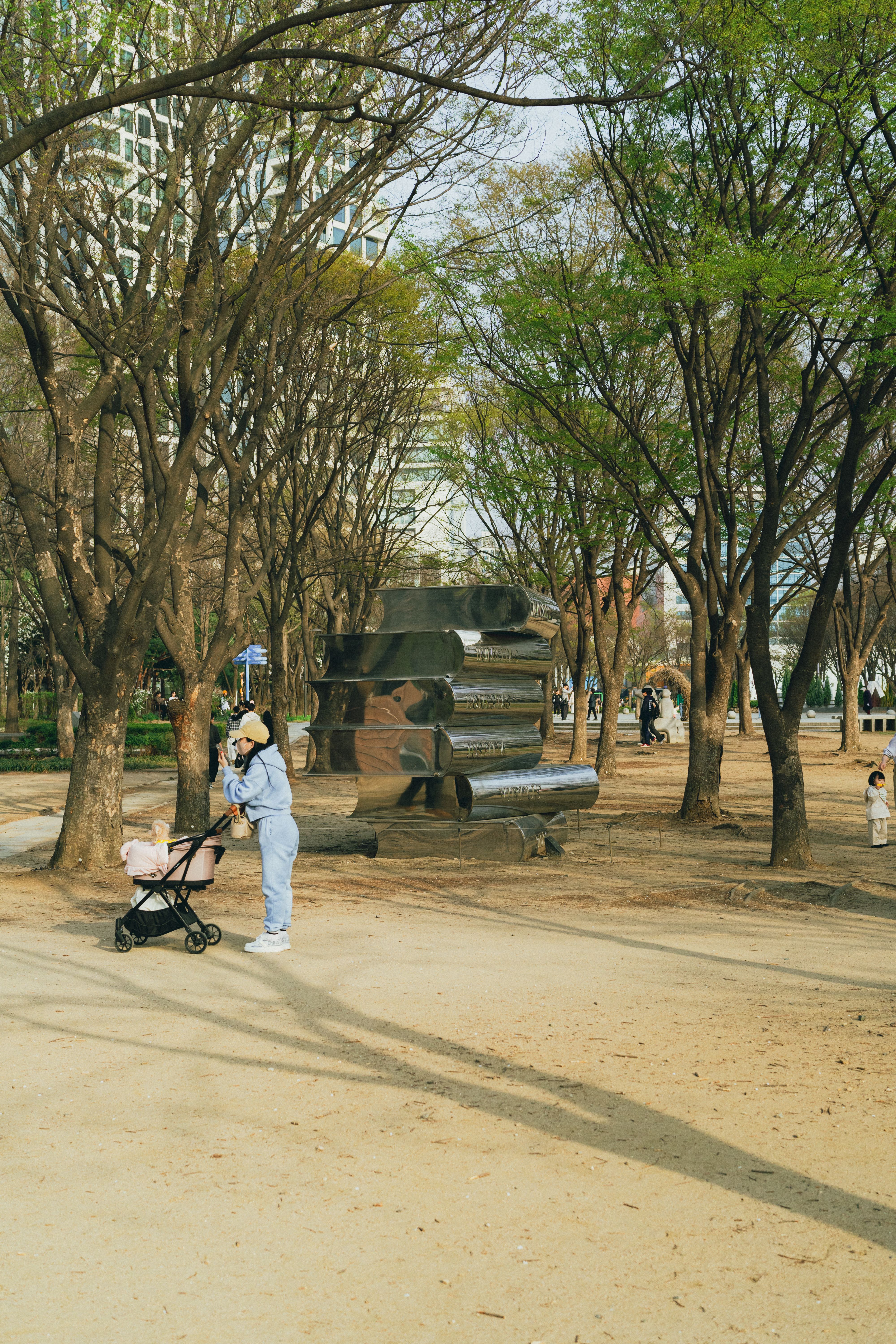 Family Stroll in a Seoul City Park During Spring · Free Stock Photo