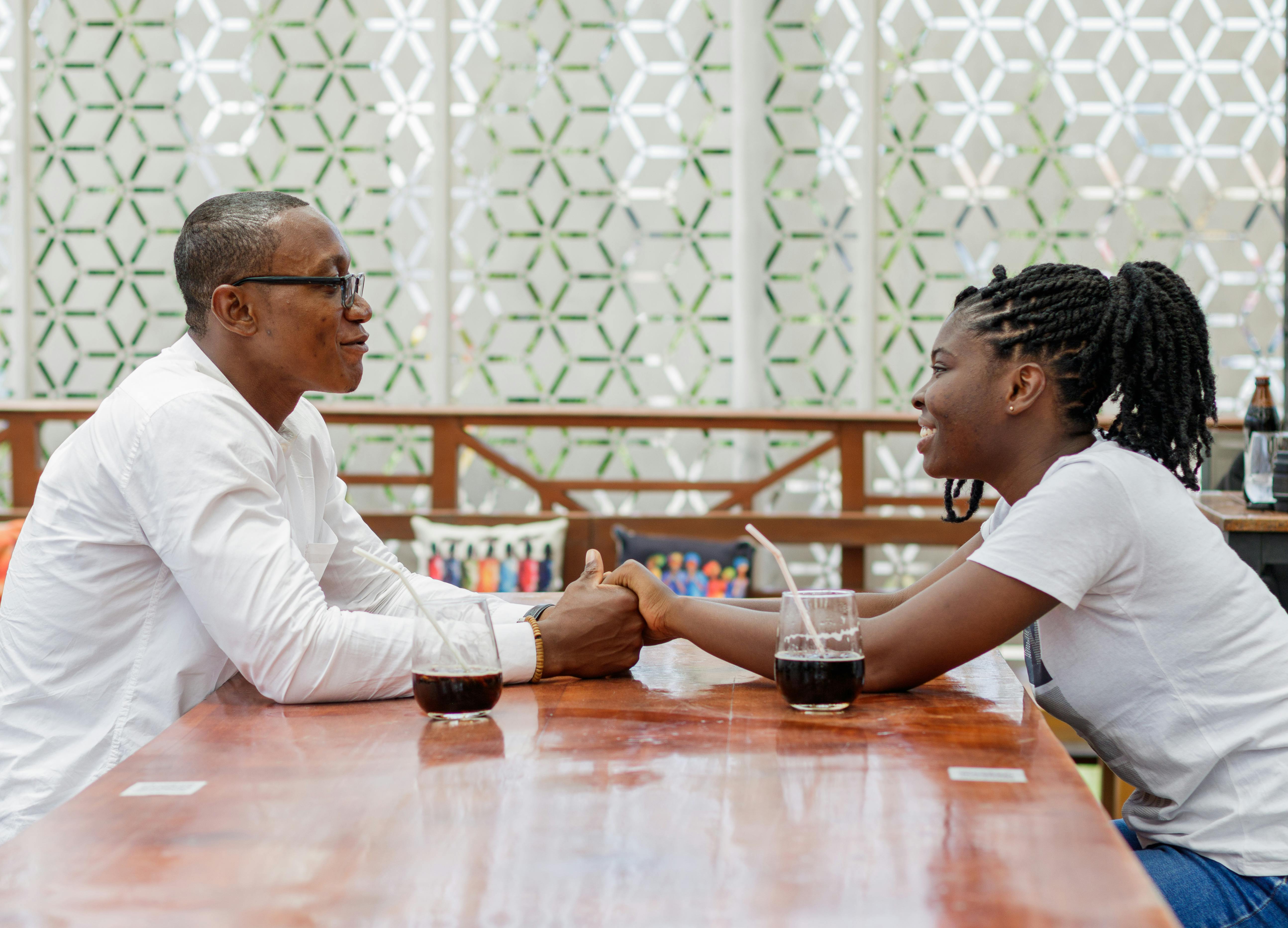 Romantic Couple Enjoying a Drink at Ghana Cafe · Free Stock Photo