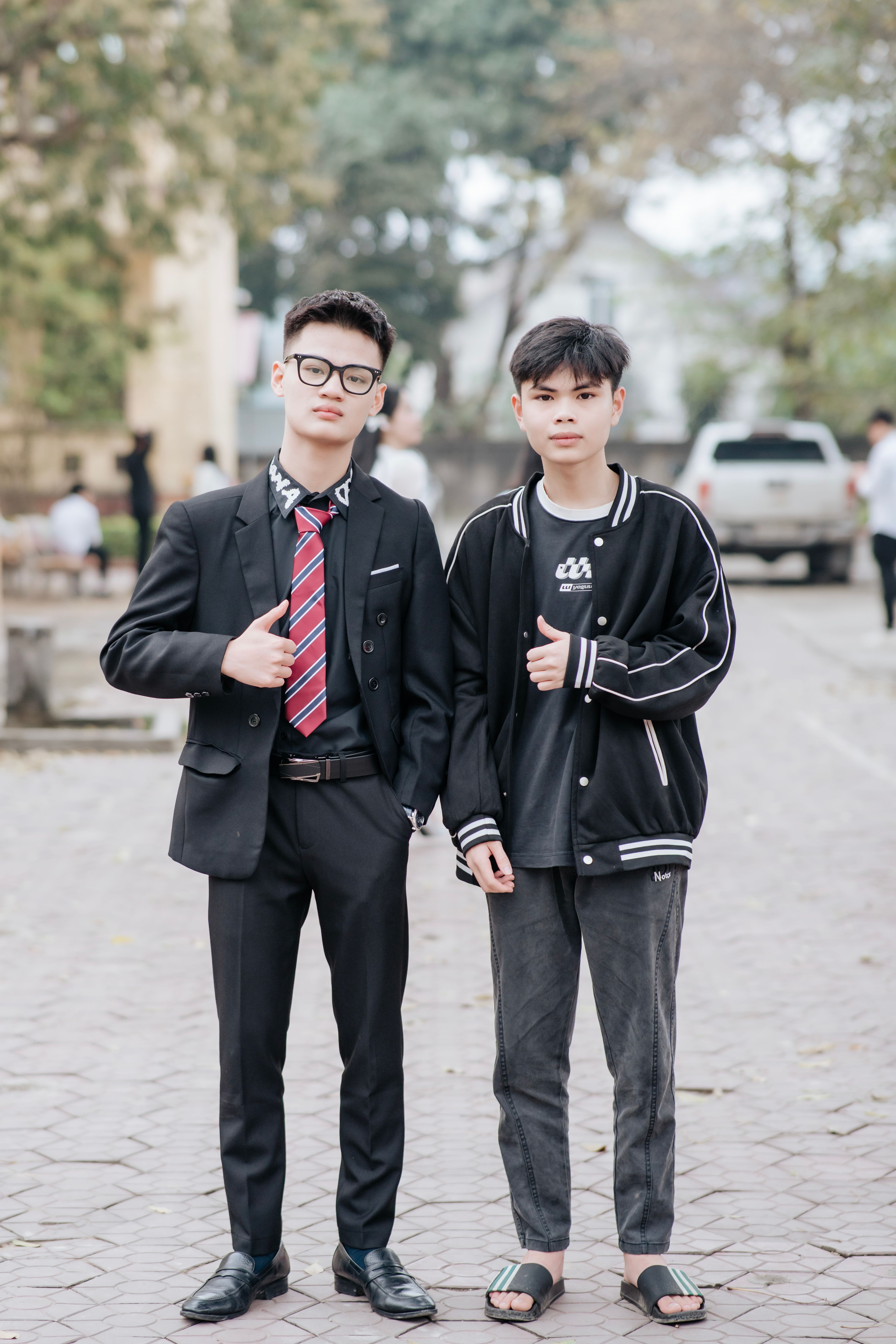 Two Friends Posing Together Outdoors · Free Stock Photo
