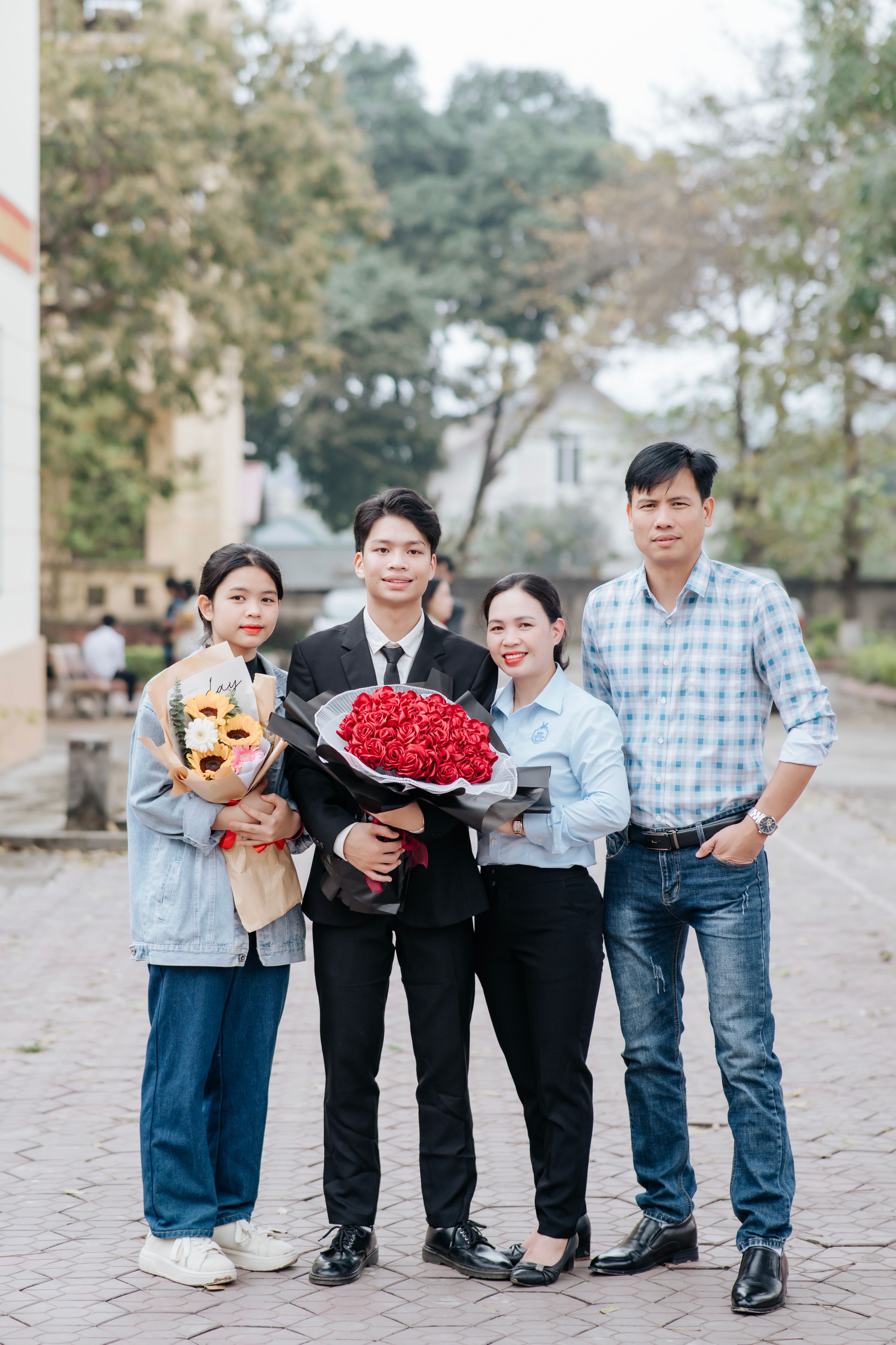 Happy Asian Family Celebrating Outdoors · Free Stock Photo