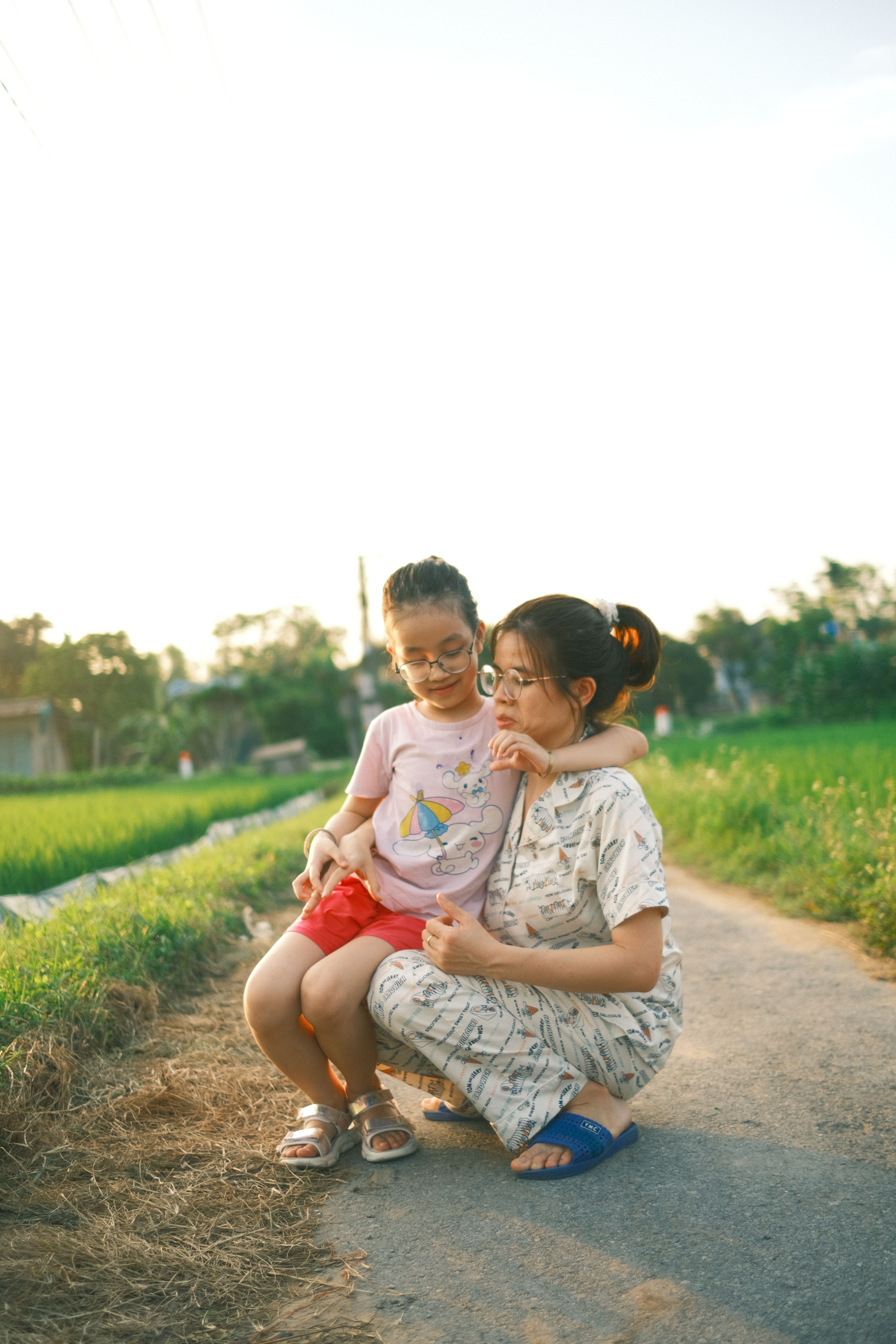 Siblings Bonding on a Quiet Country Path · Free Stock Photo