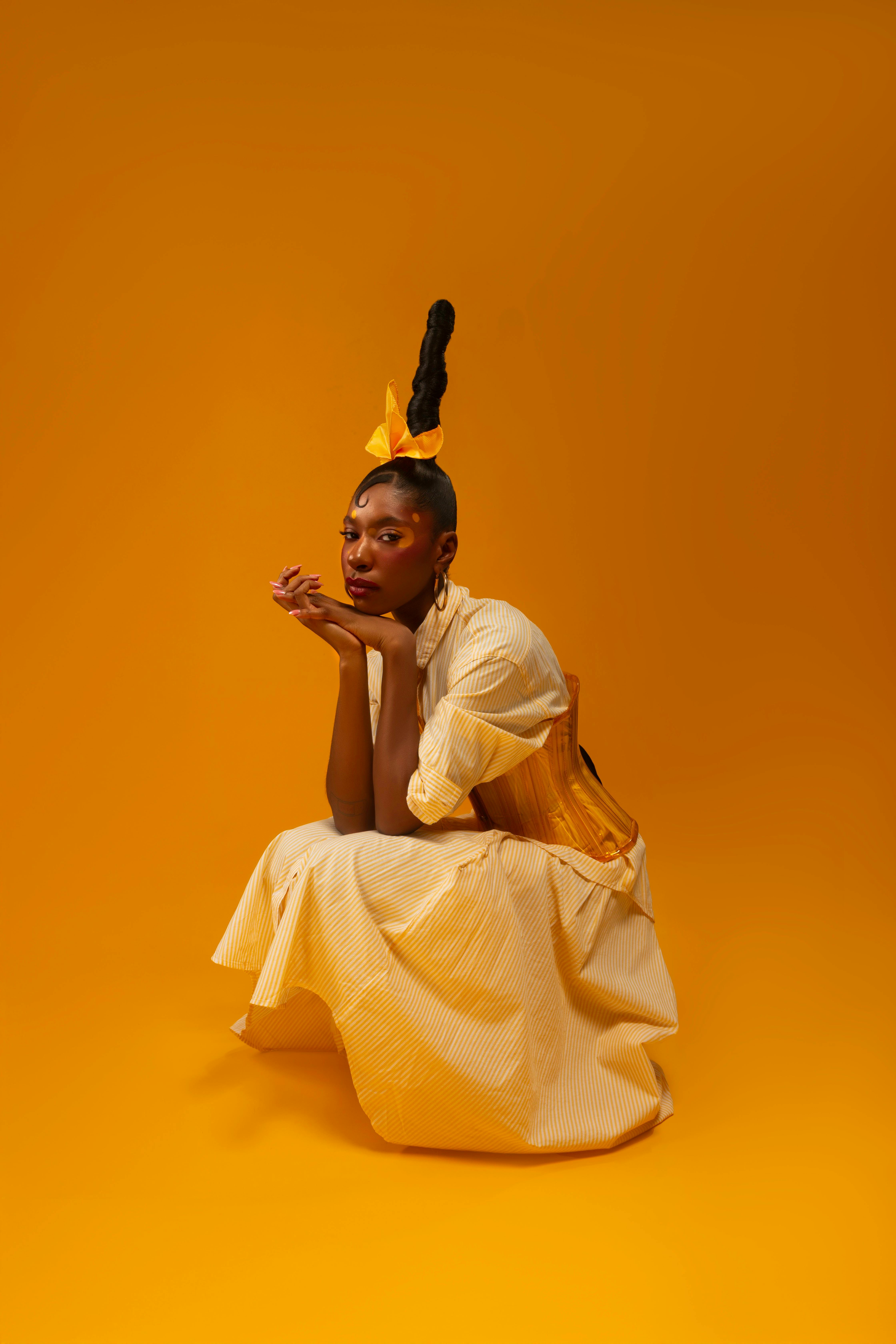 Expressive Fashion Portrait in Vibrant Yellow · Free Stock Photo