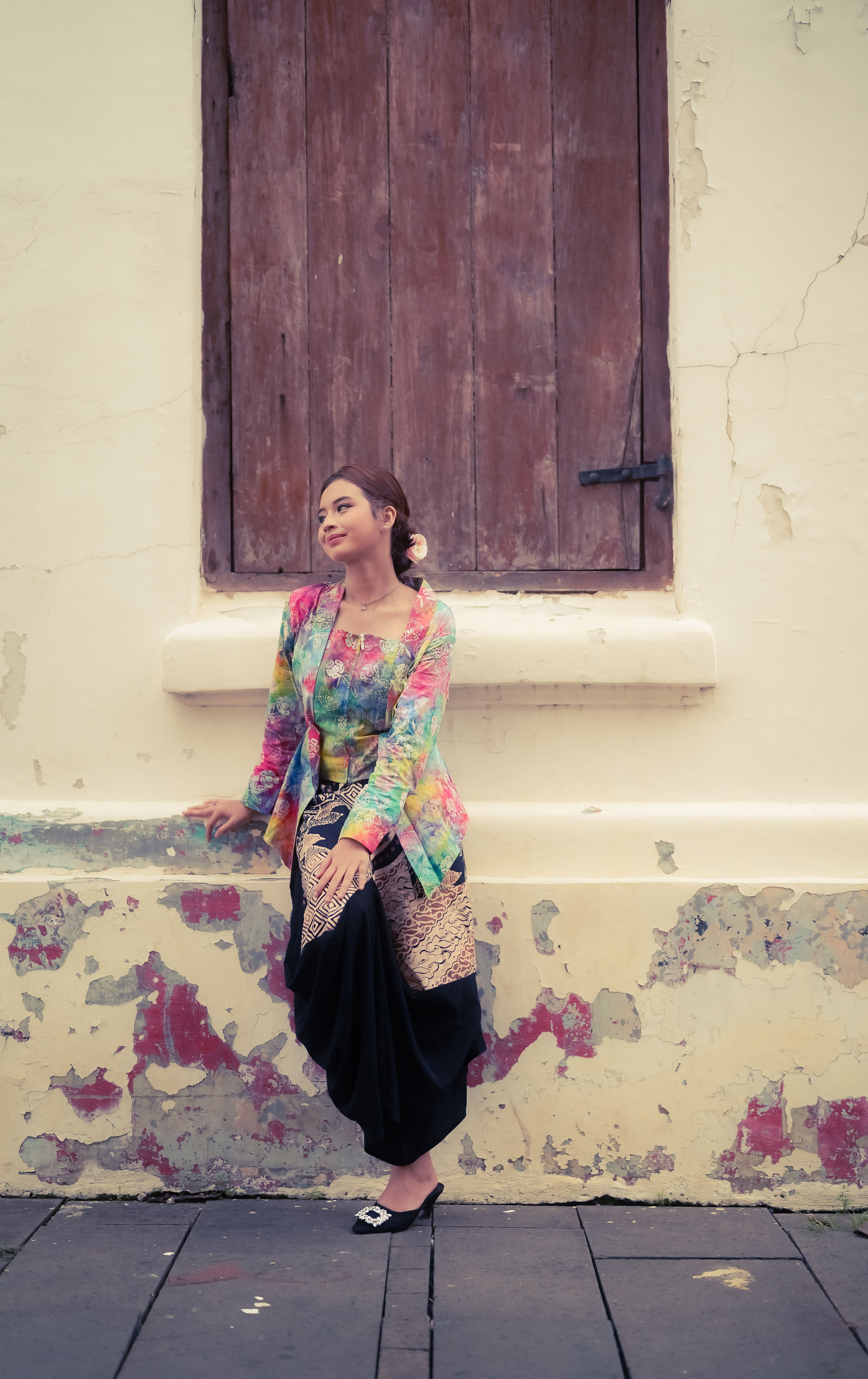 Stylish Woman in Traditional Outfit by Rustic Wall · Free Stock Photo