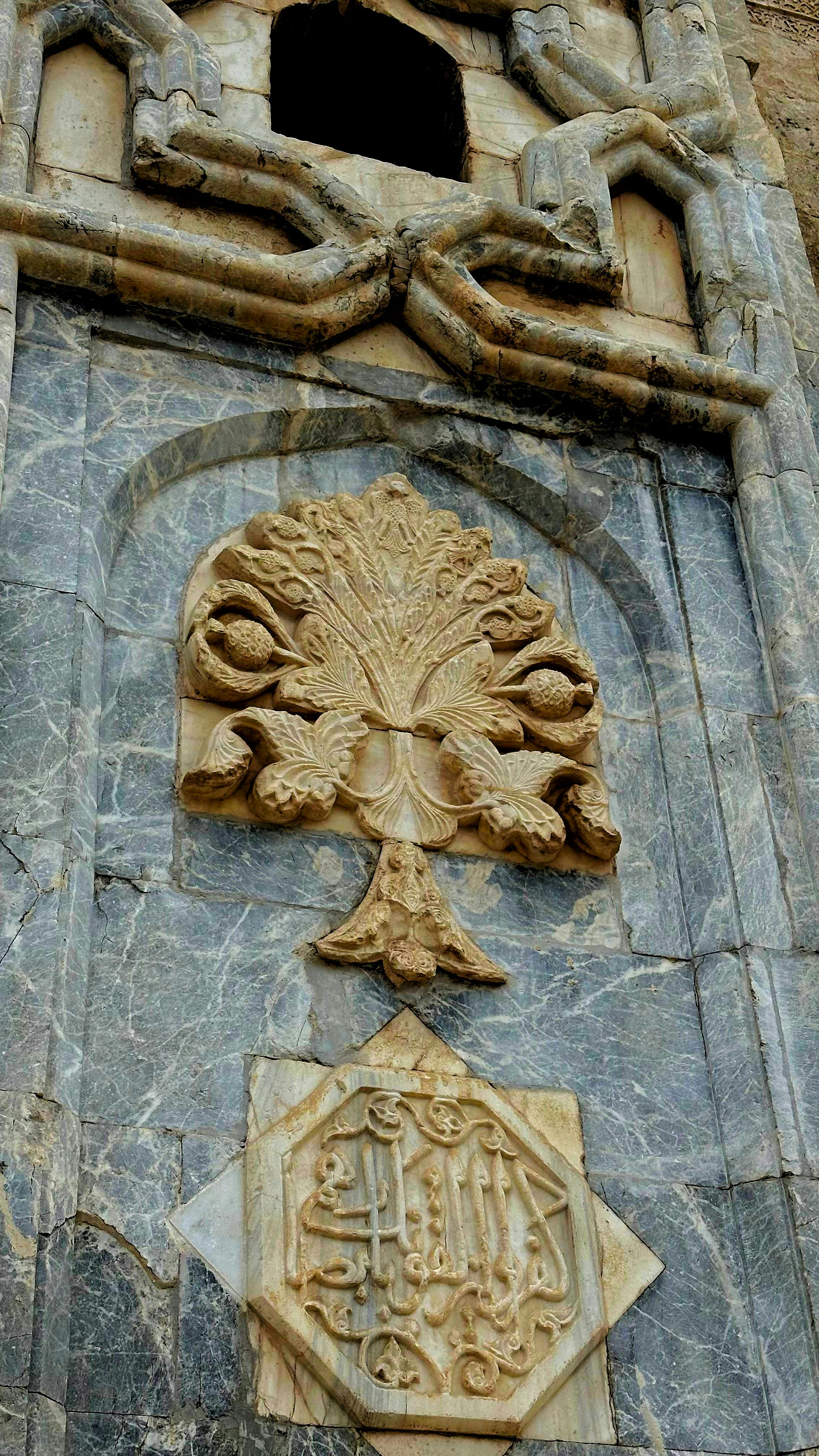 Intricate Stone Carving on Ancient Structure Wall · Free Stock Photo