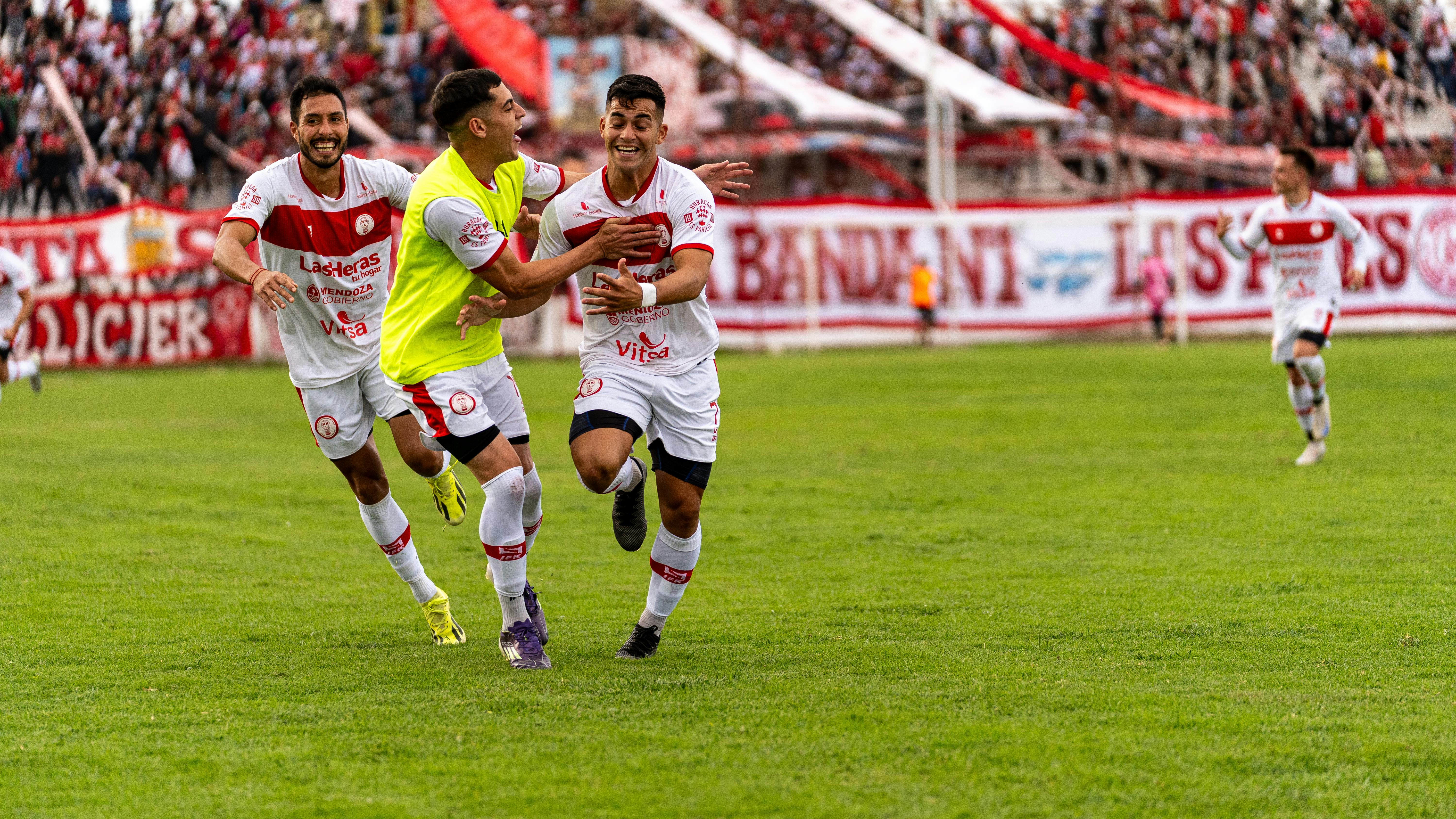 Exciting Football Match with Celebrating Players · Free Stock Photo