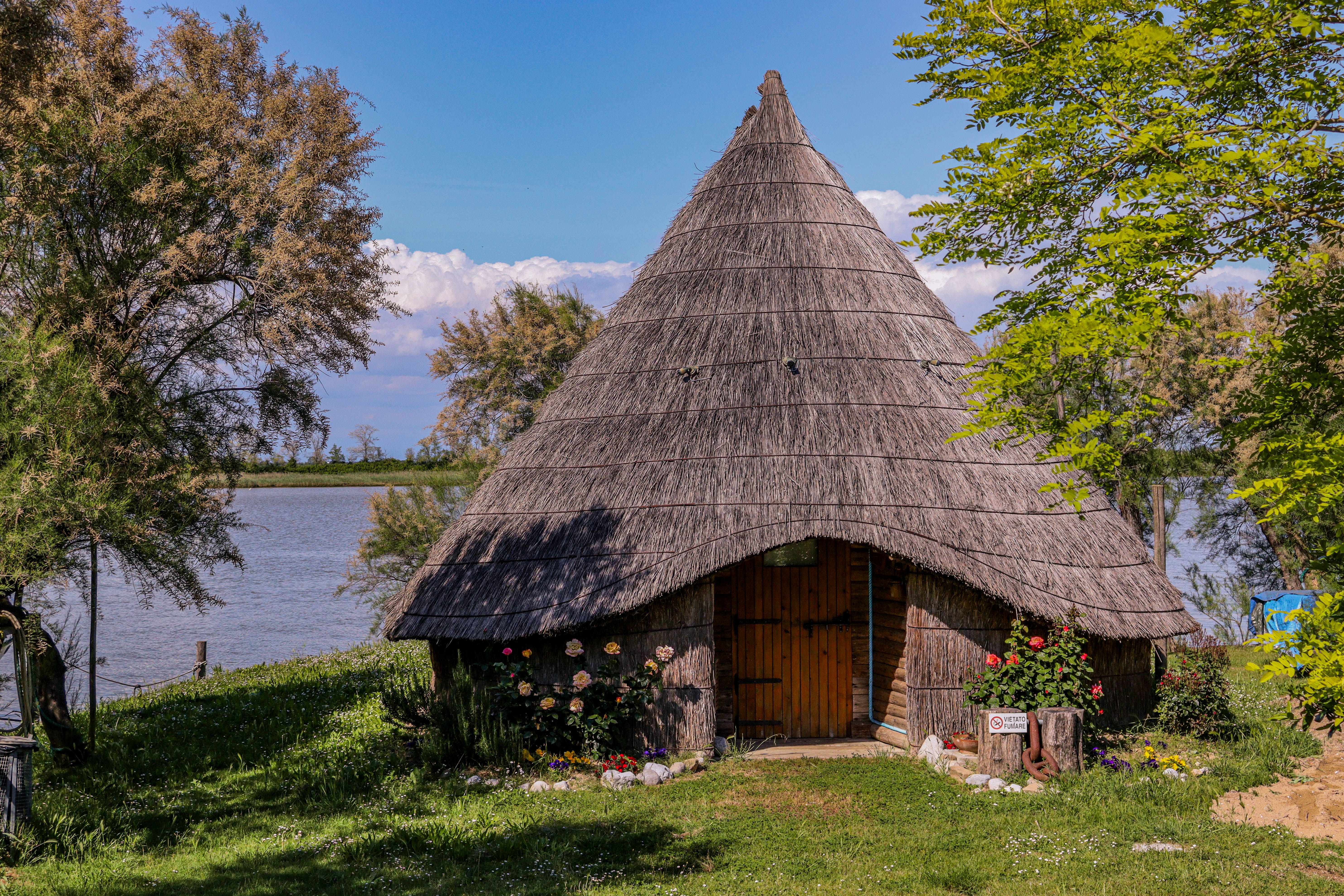 Traditional Rural Thatched Hut by the Lake · Free Stock Photo