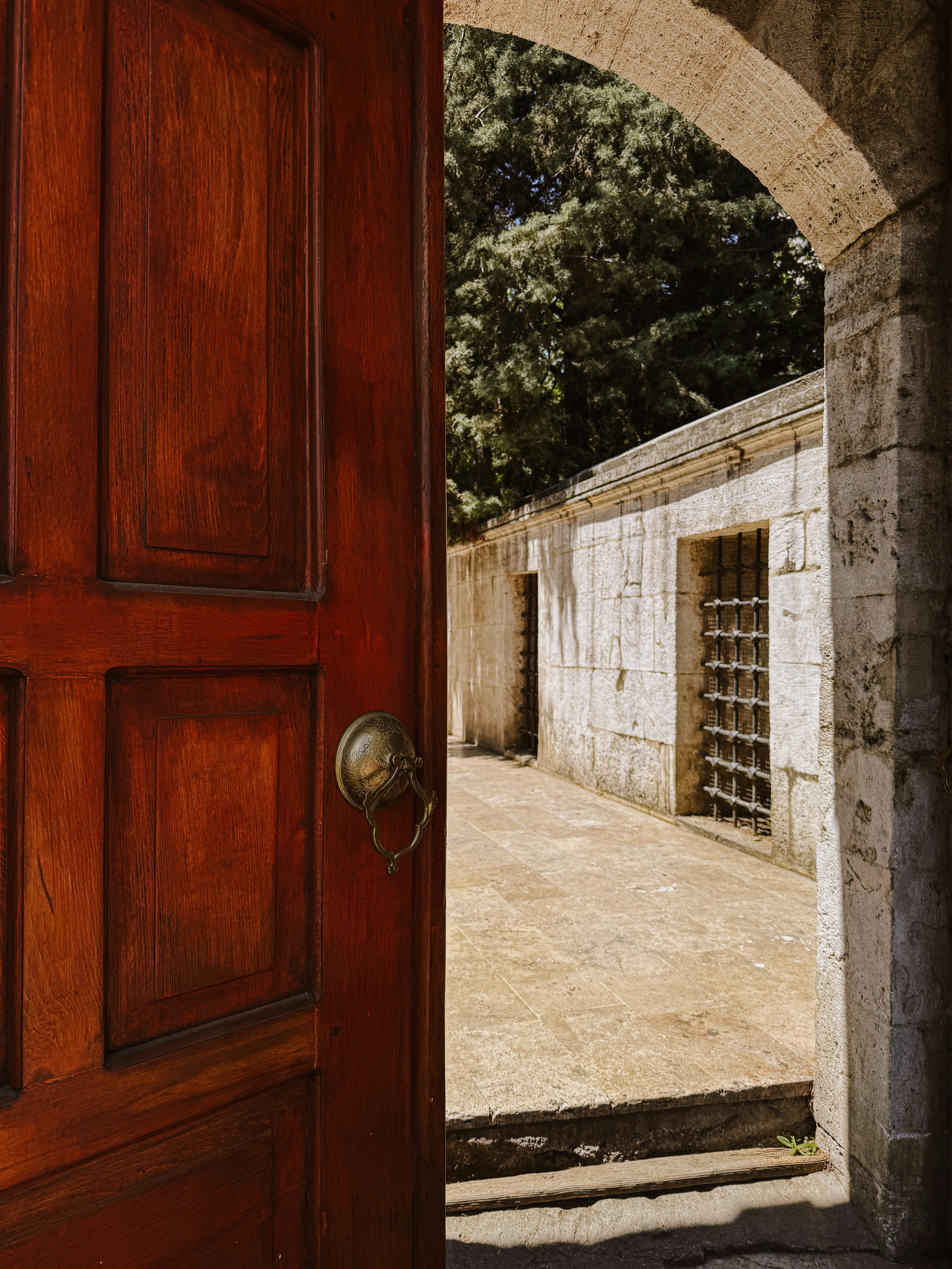 Open Wooden Door Leading to Stone Courtyard · Free Stock Photo