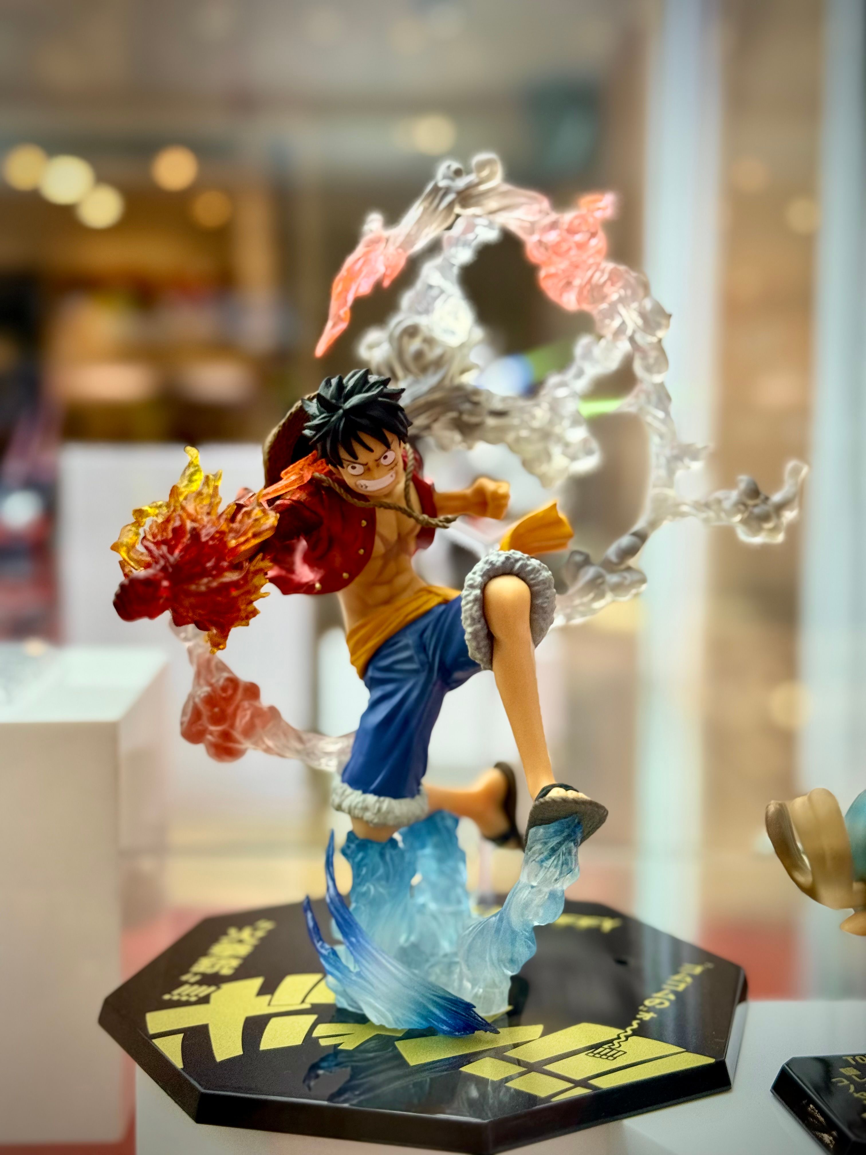 Dynamic Anime Action Figure with Fiery Effects · Free Stock Photo