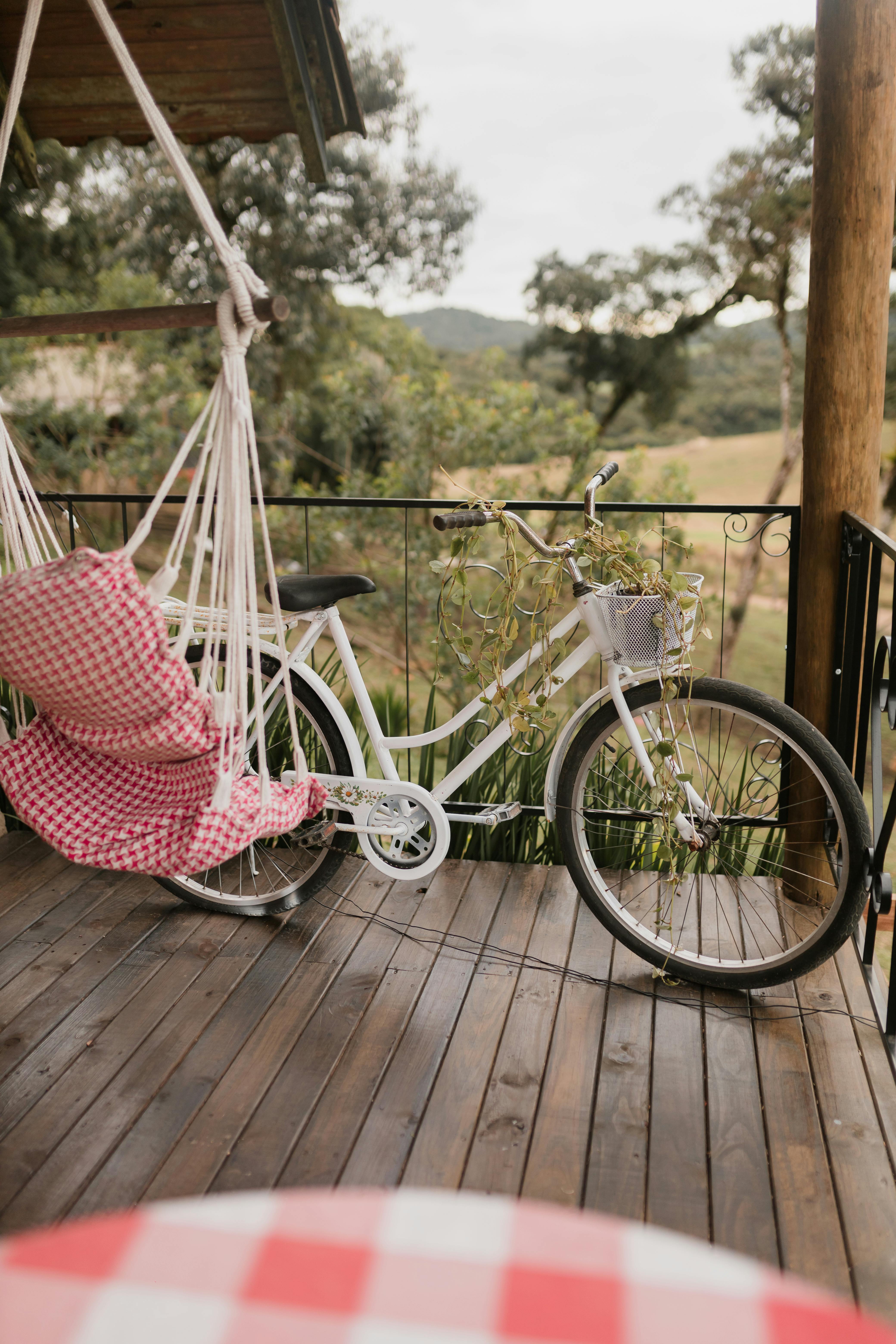 Rustic Bicycle and Swing on Wooden Deck · Free Stock Photo