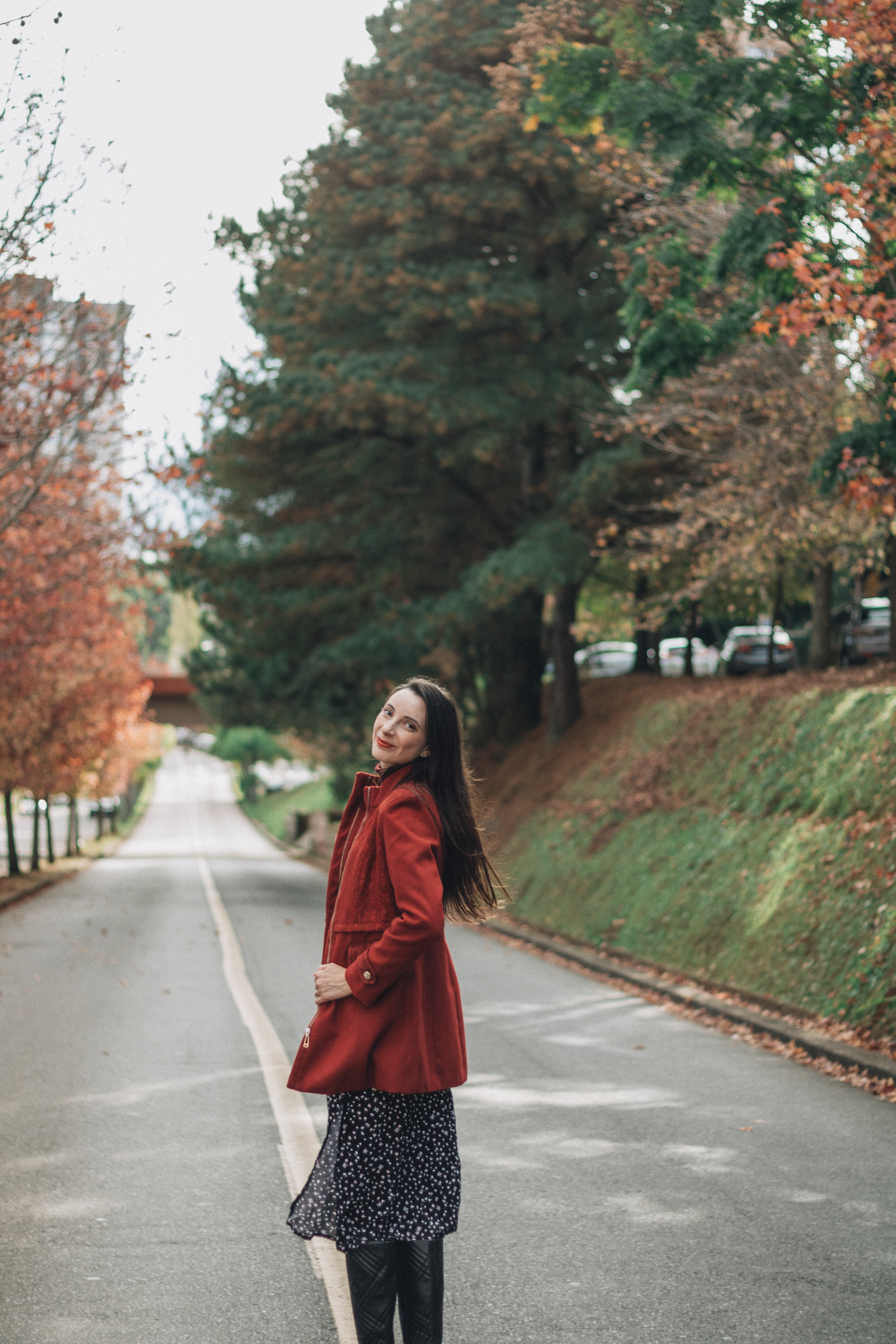 Young Woman in Red Coat on Autumn Street · Free Stock Photo