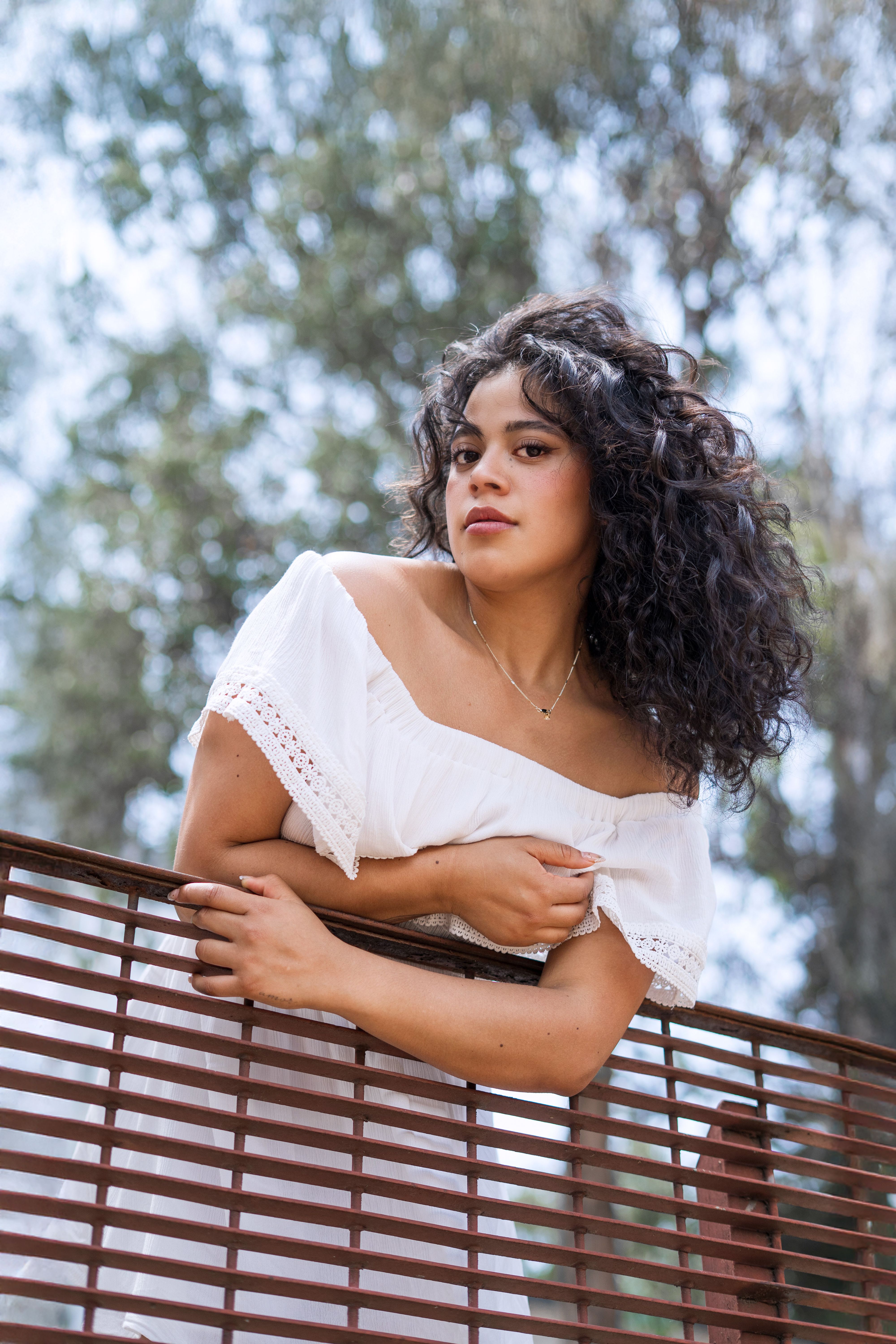 Outdoor Portrait of Woman with Curly Hair · Free Stock Photo