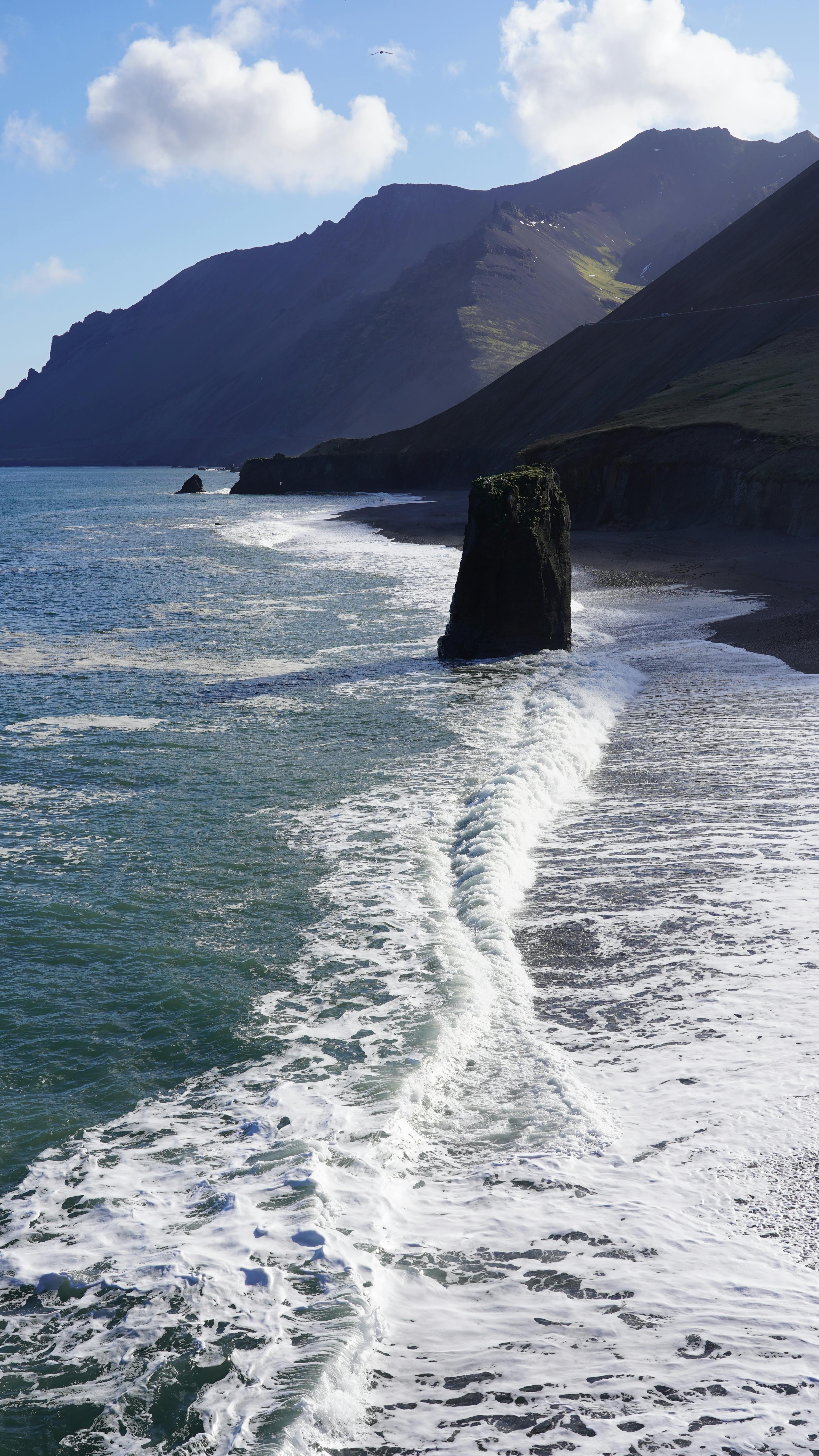 Scenic Icelandic Coastline with Sea Stack · Free Stock Photo