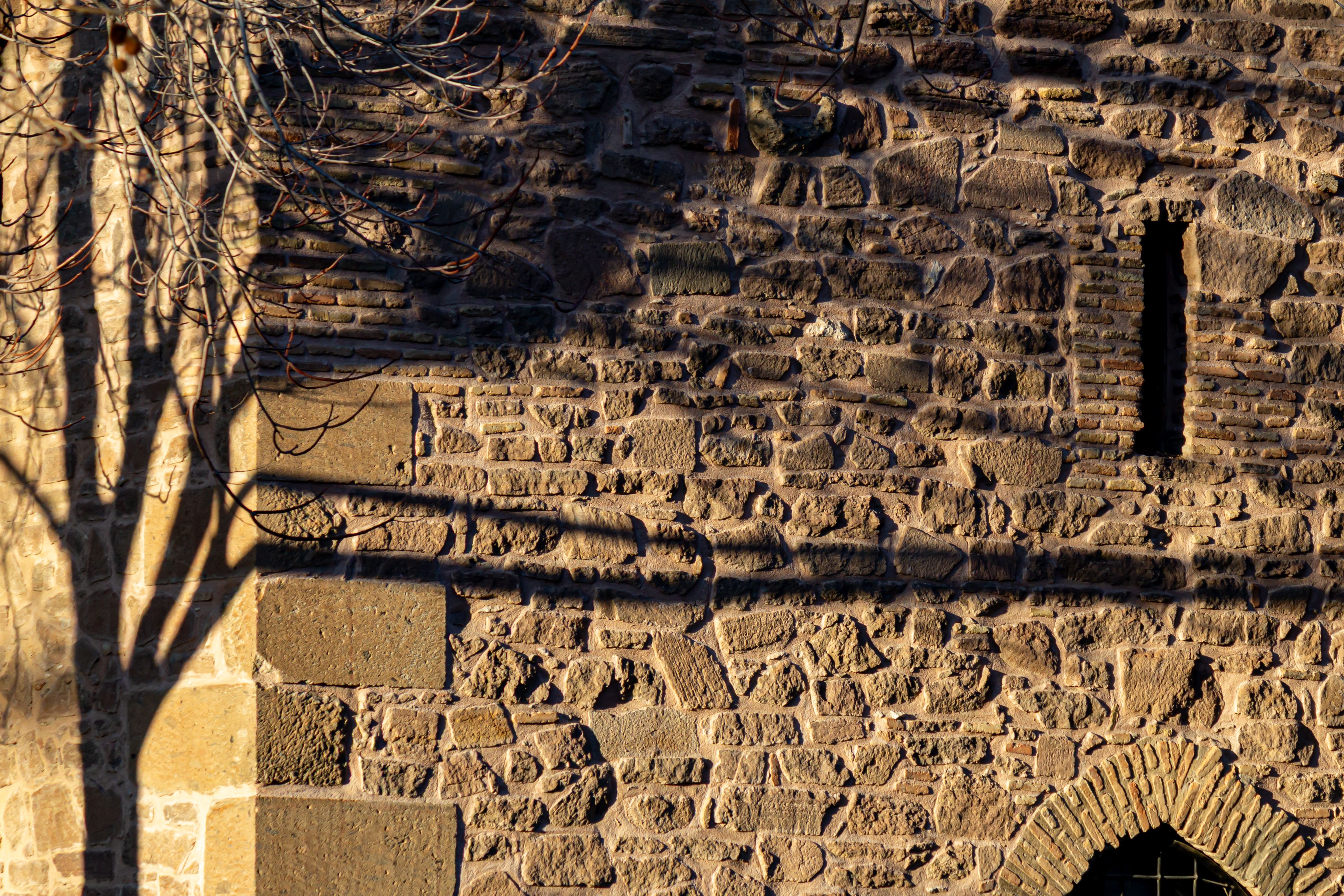 Historic Stone Wall with Tree Shadows in Konya · Free Stock Photo