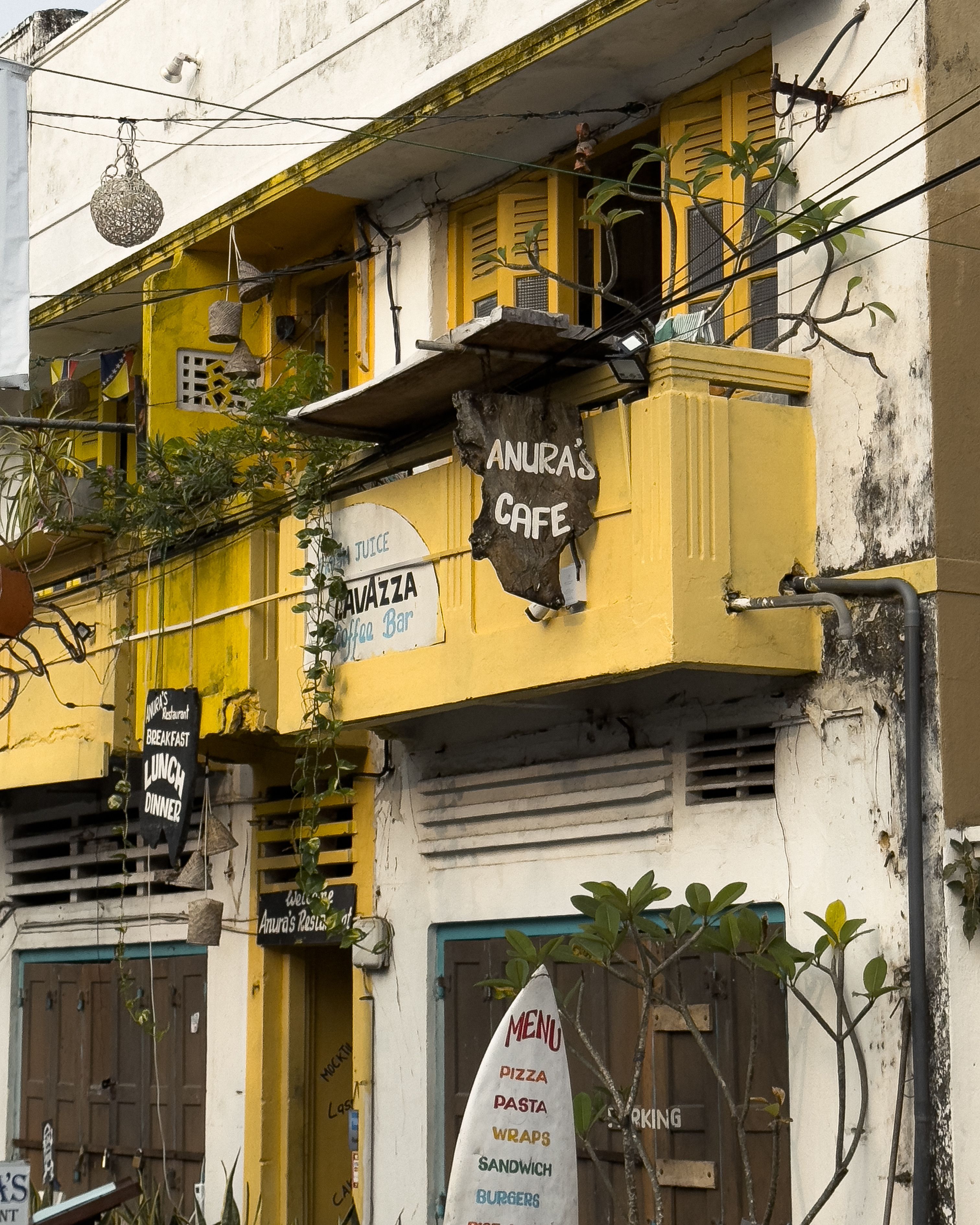 Charming Yellow Cafe Facade in Urban Street · Free Stock Photo