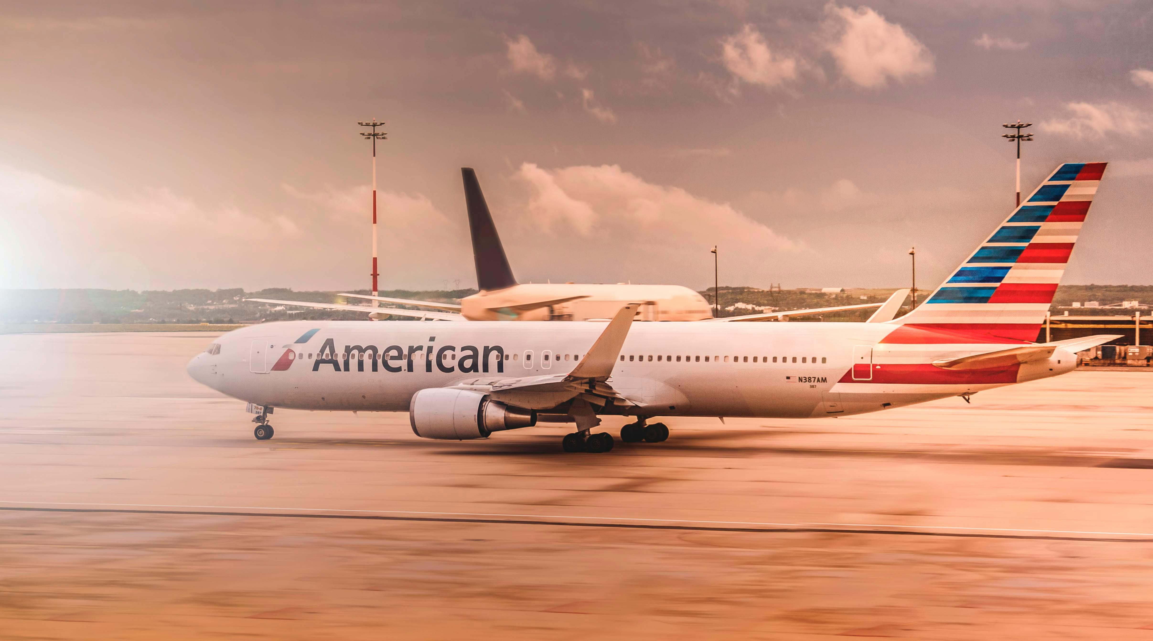 White American Airplane Parked on Airport · Free Stock Photo