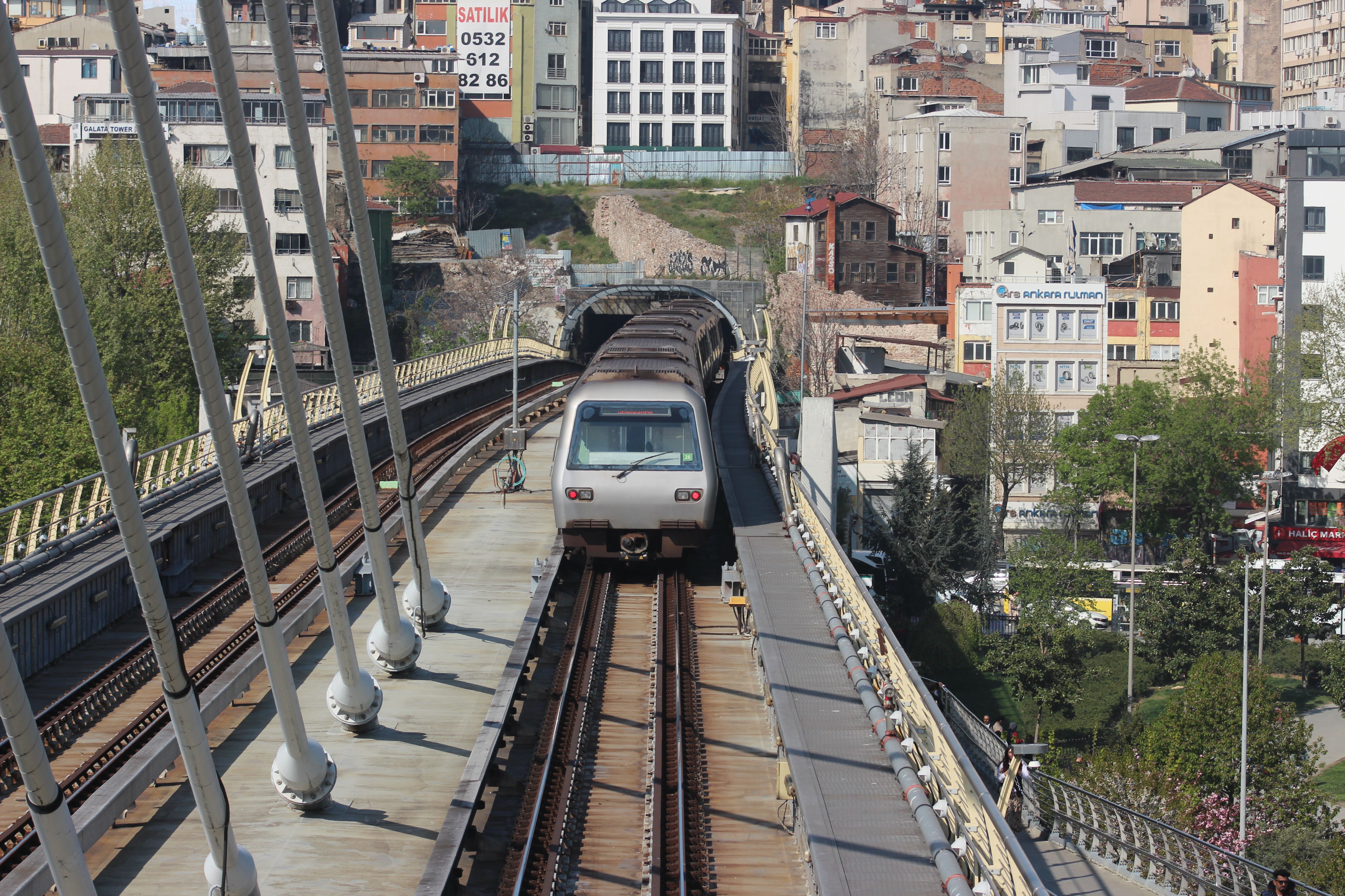 Modern Train on Bridge in Urban Area · Free Stock Photo