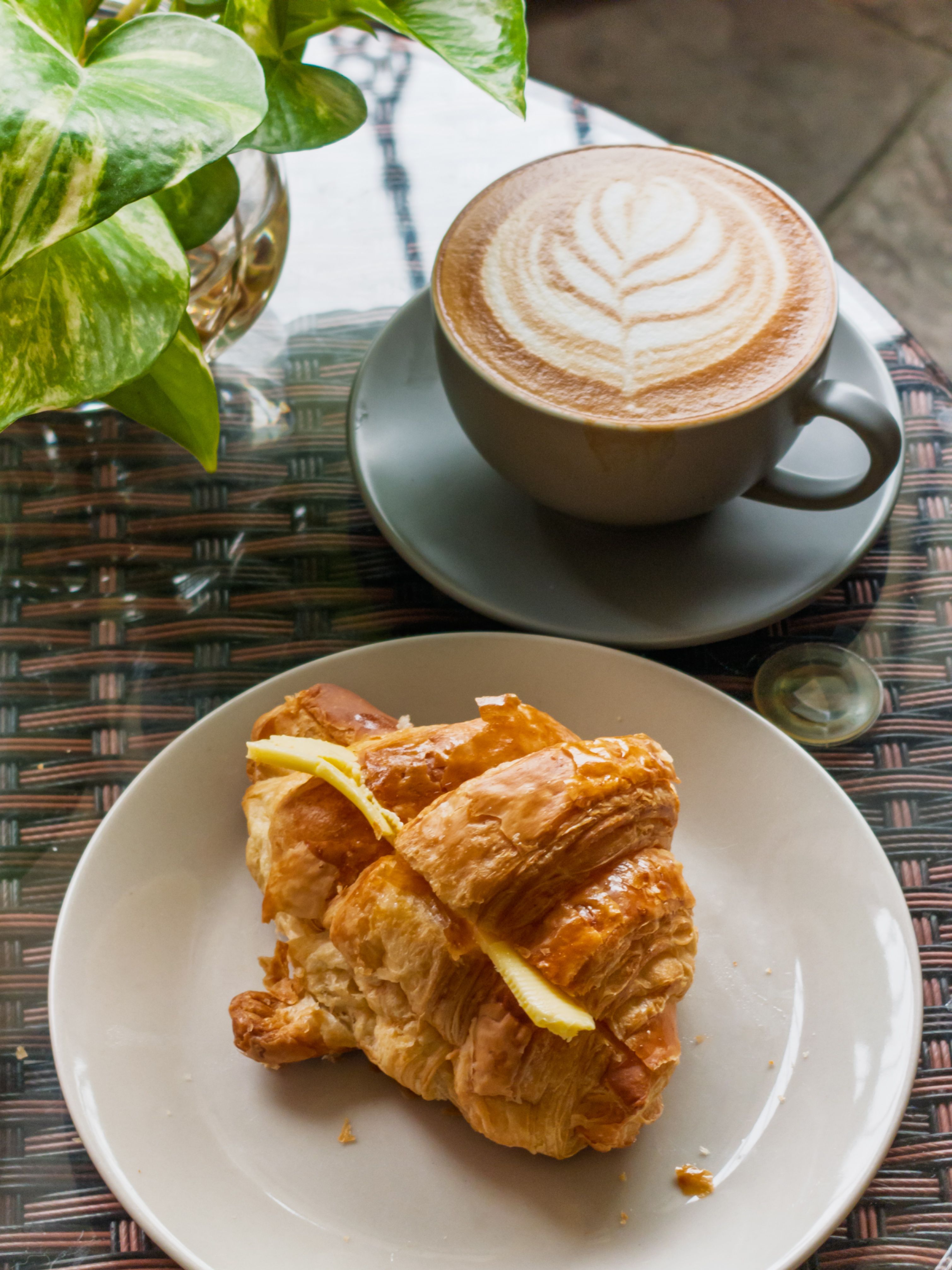 Delicious Croissant and Latte on Cafe Table · Free Stock Photo