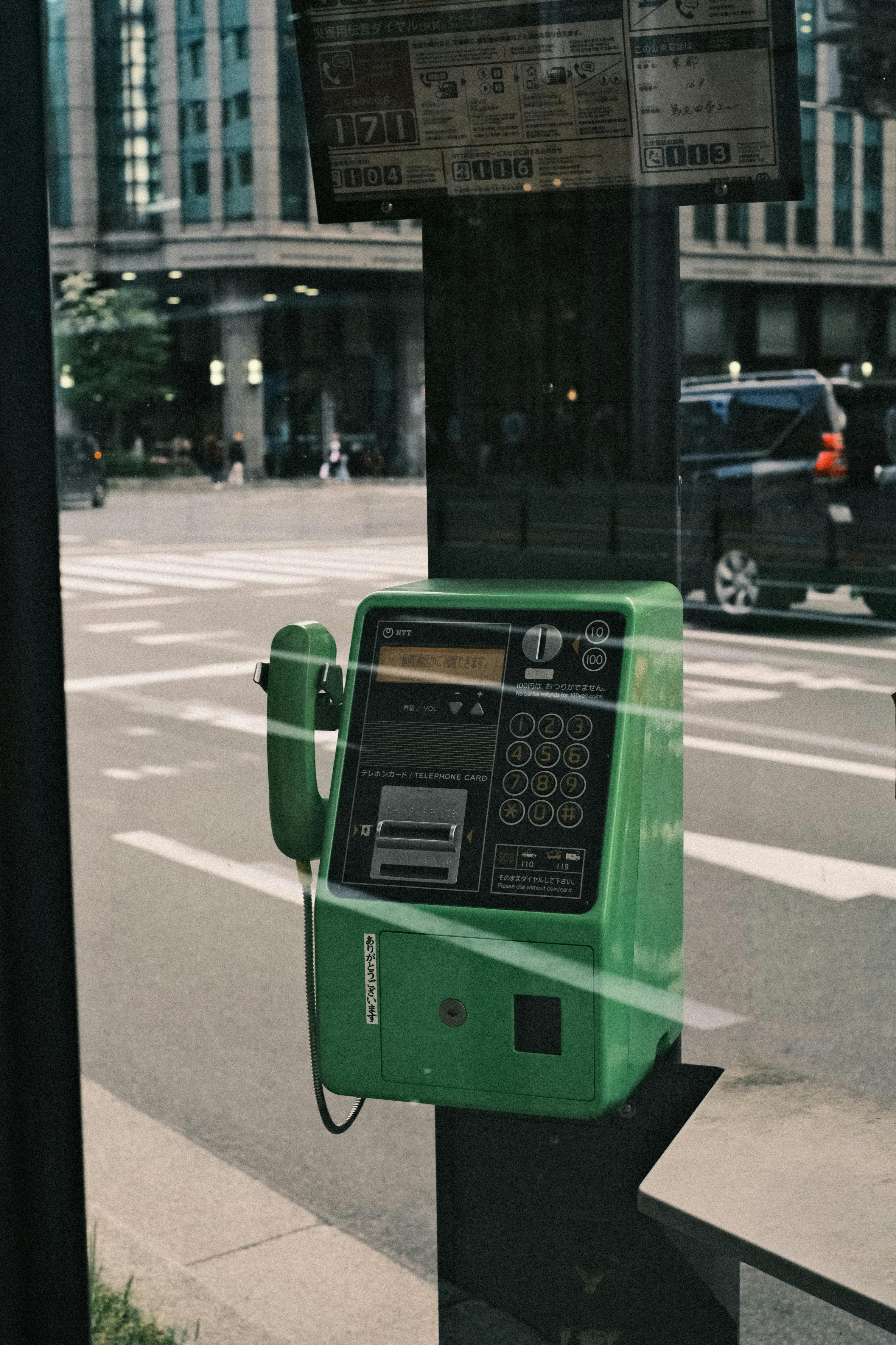 Vintage Green Public Phone on Urban Street · Free Stock Photo