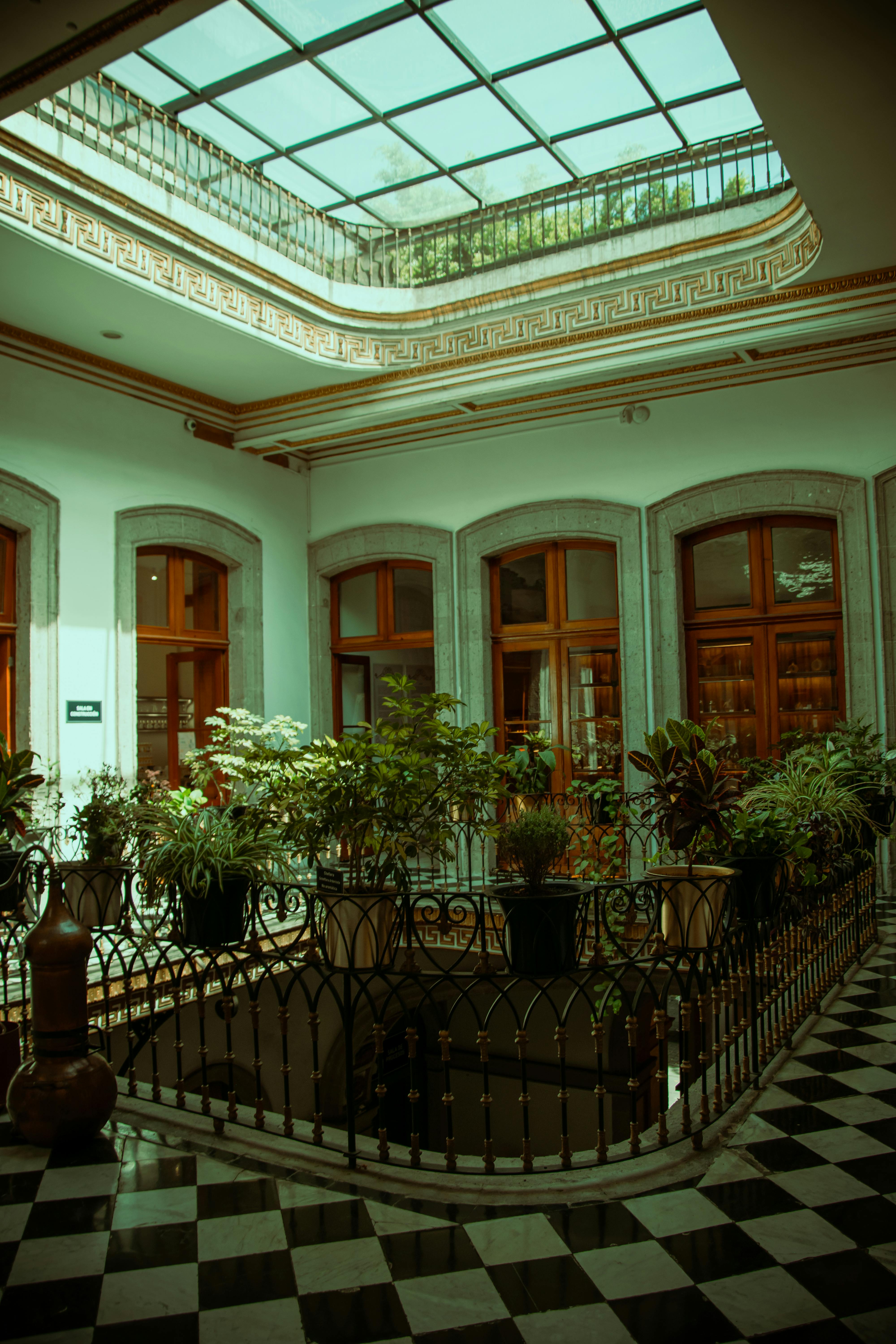 Elegant Indoor Atrium with Checkered Floor · Free Stock Photo