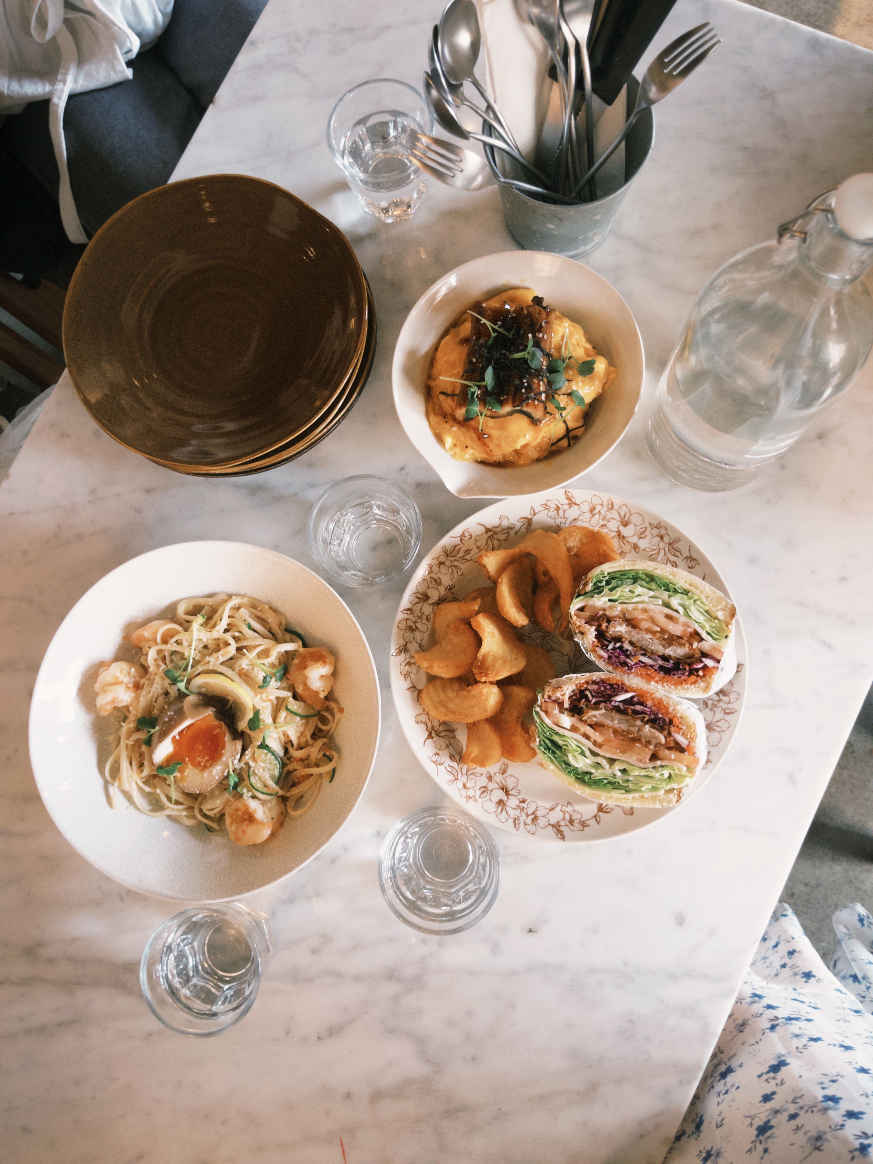Assorted Lunch Dishes on Marble Table · Free Stock Photo