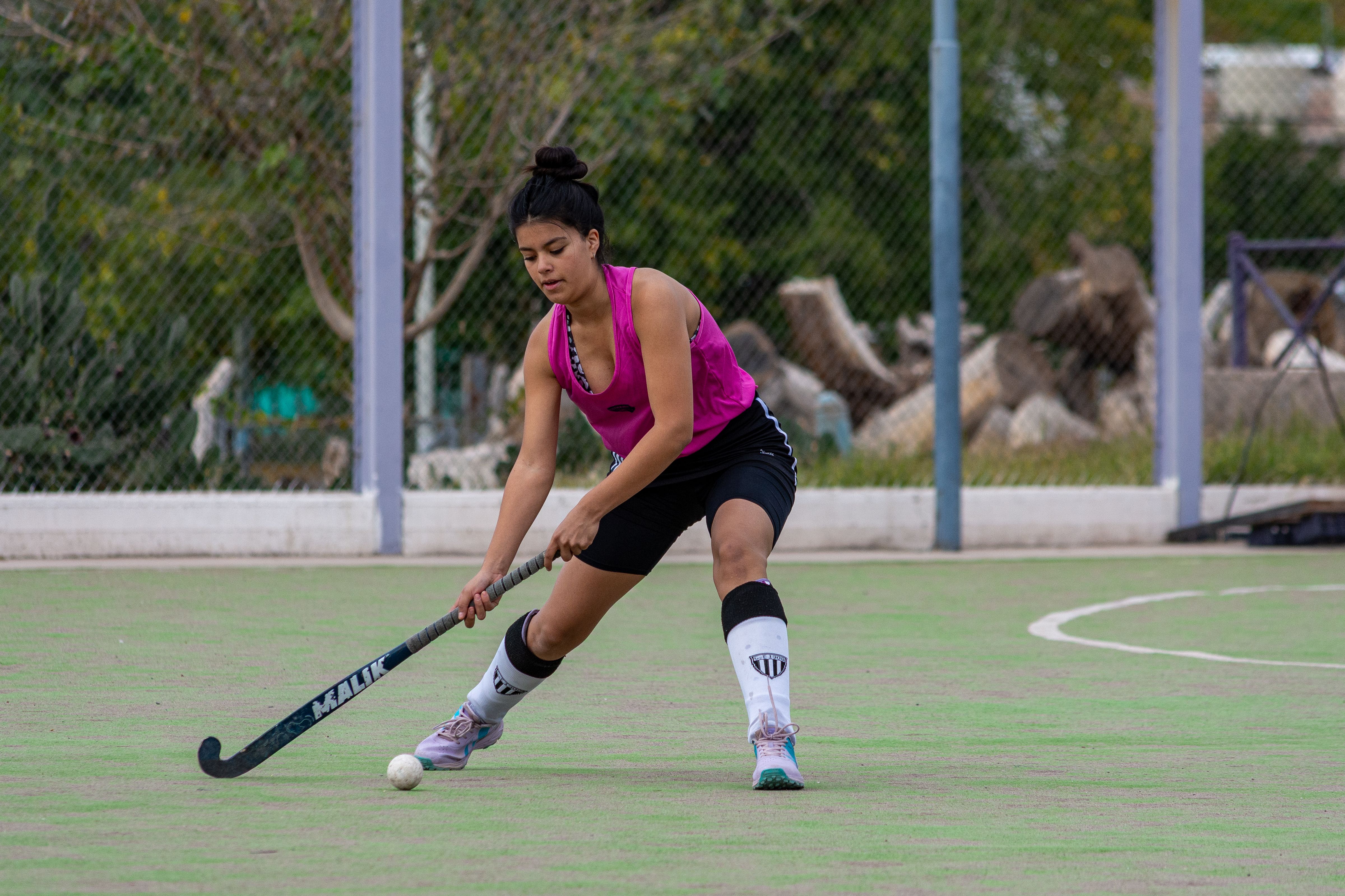 Female Field Hockey Player in Action · Free Stock Photo