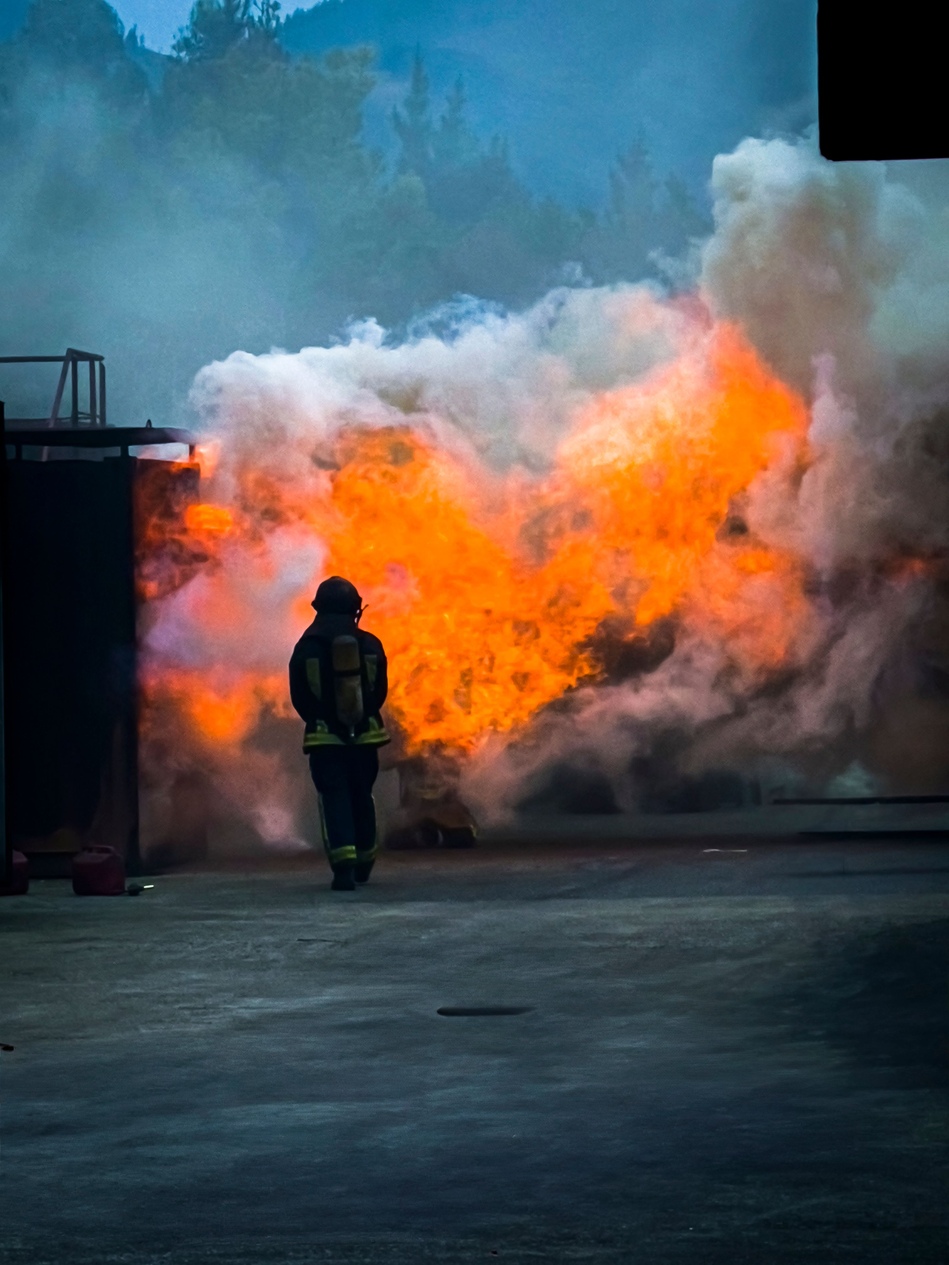 Brave Firefighter Battling Intense Blaze Outdoors · Free Stock Photo
