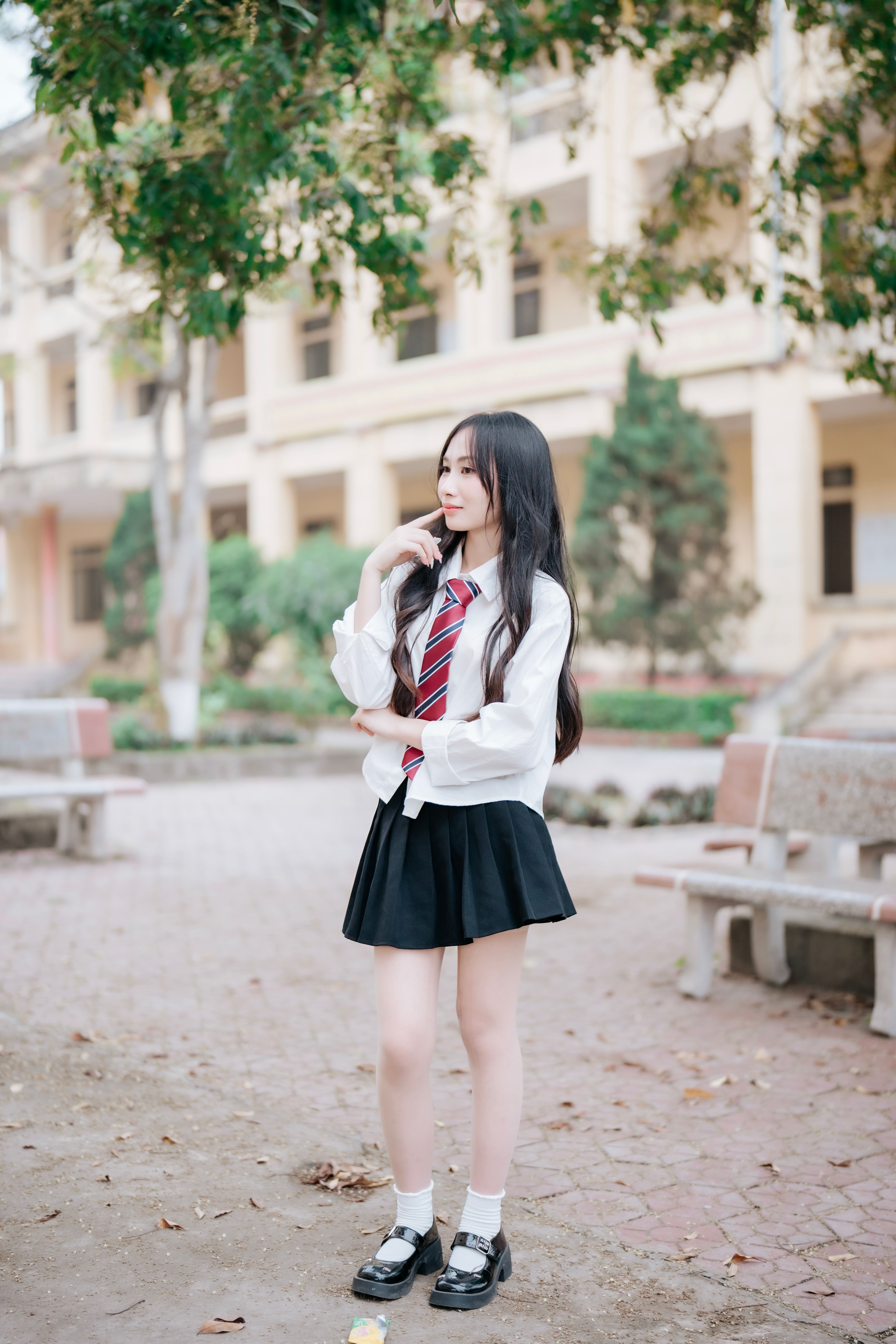 Young Student in Uniform Outdoors at School · Free Stock Photo