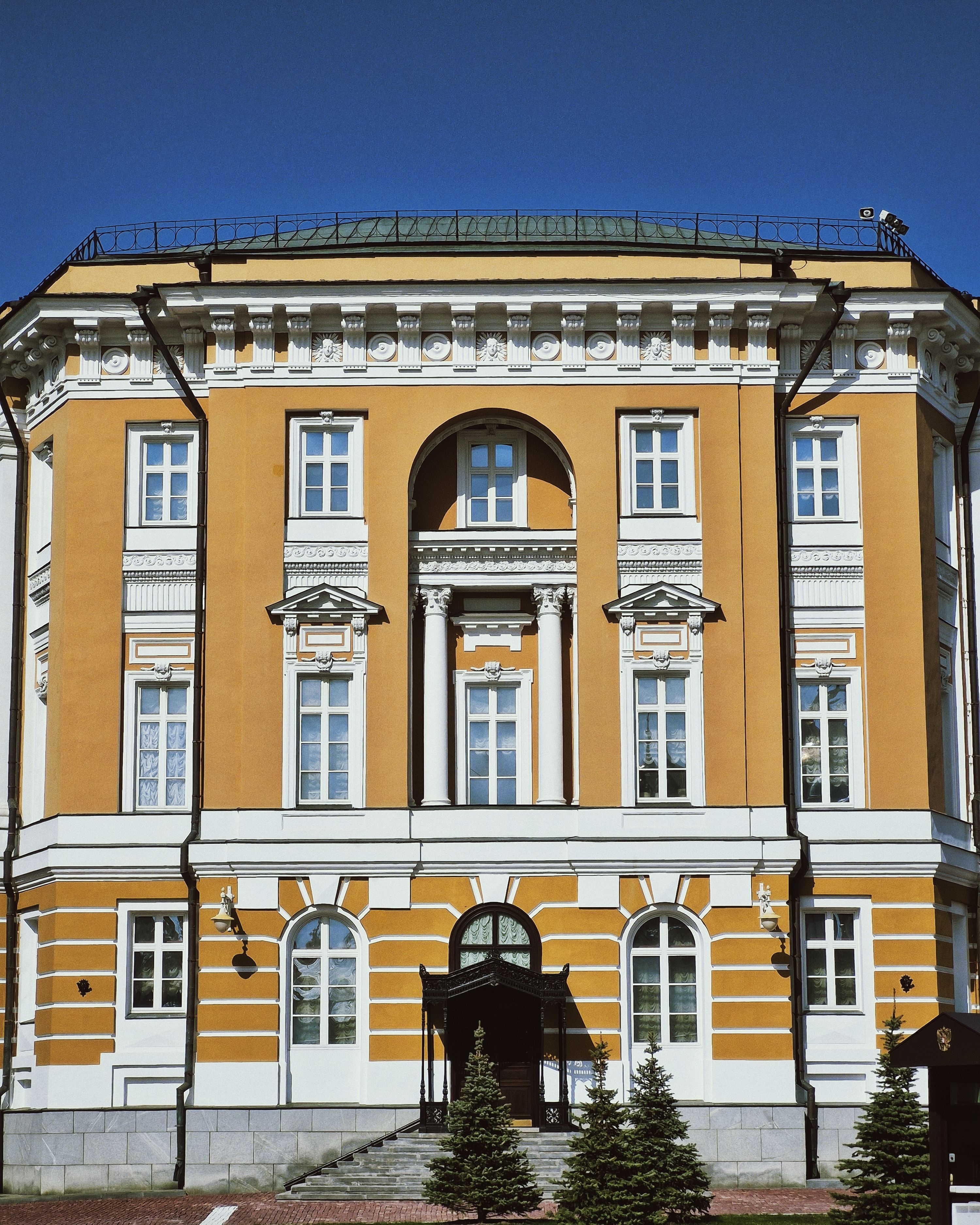 Historic Yellow Building with Clear Blue Sky · Free Stock Photo