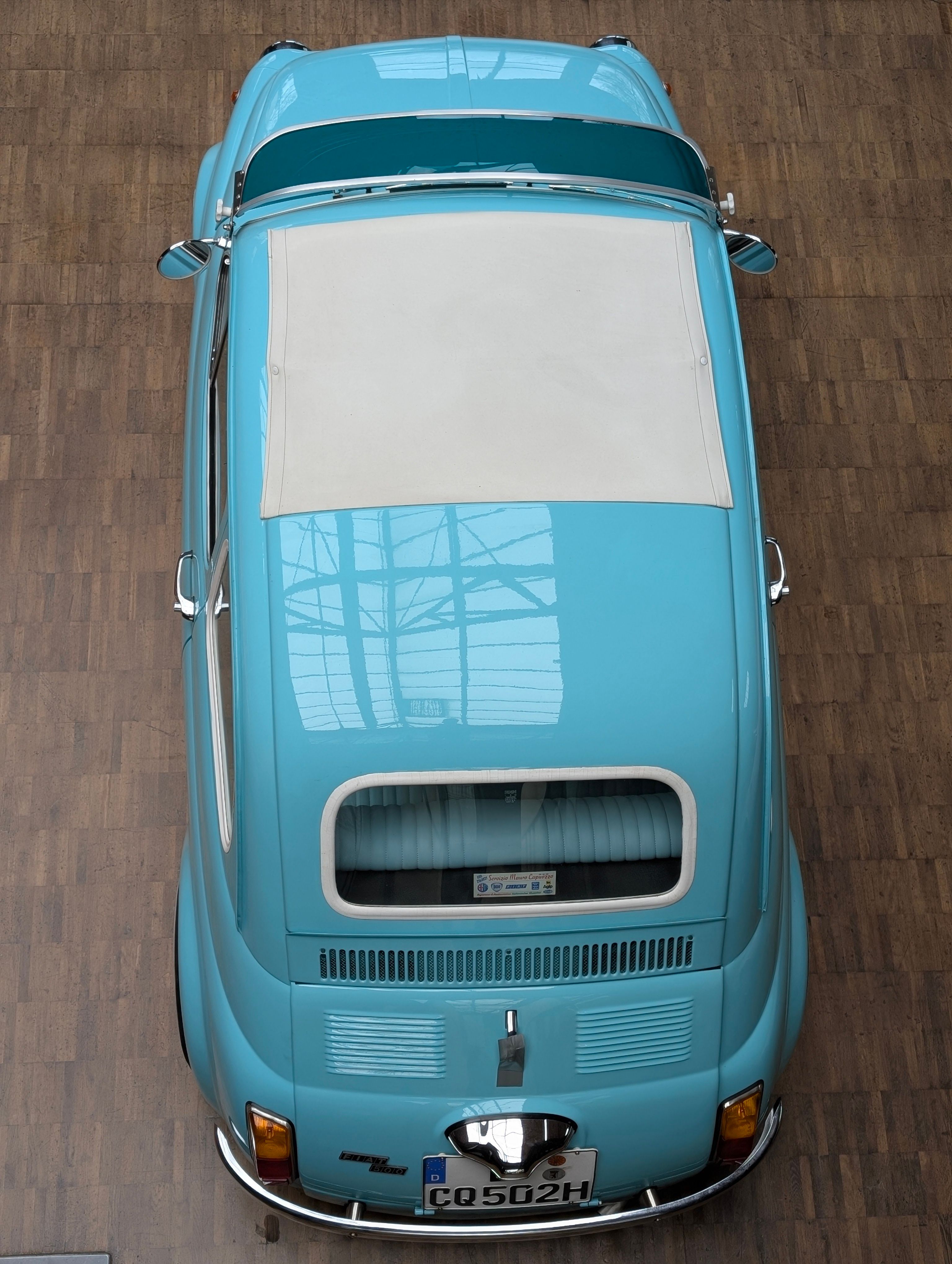 Vintage Blue Car Viewed from Above Indoors · Free Stock Photo