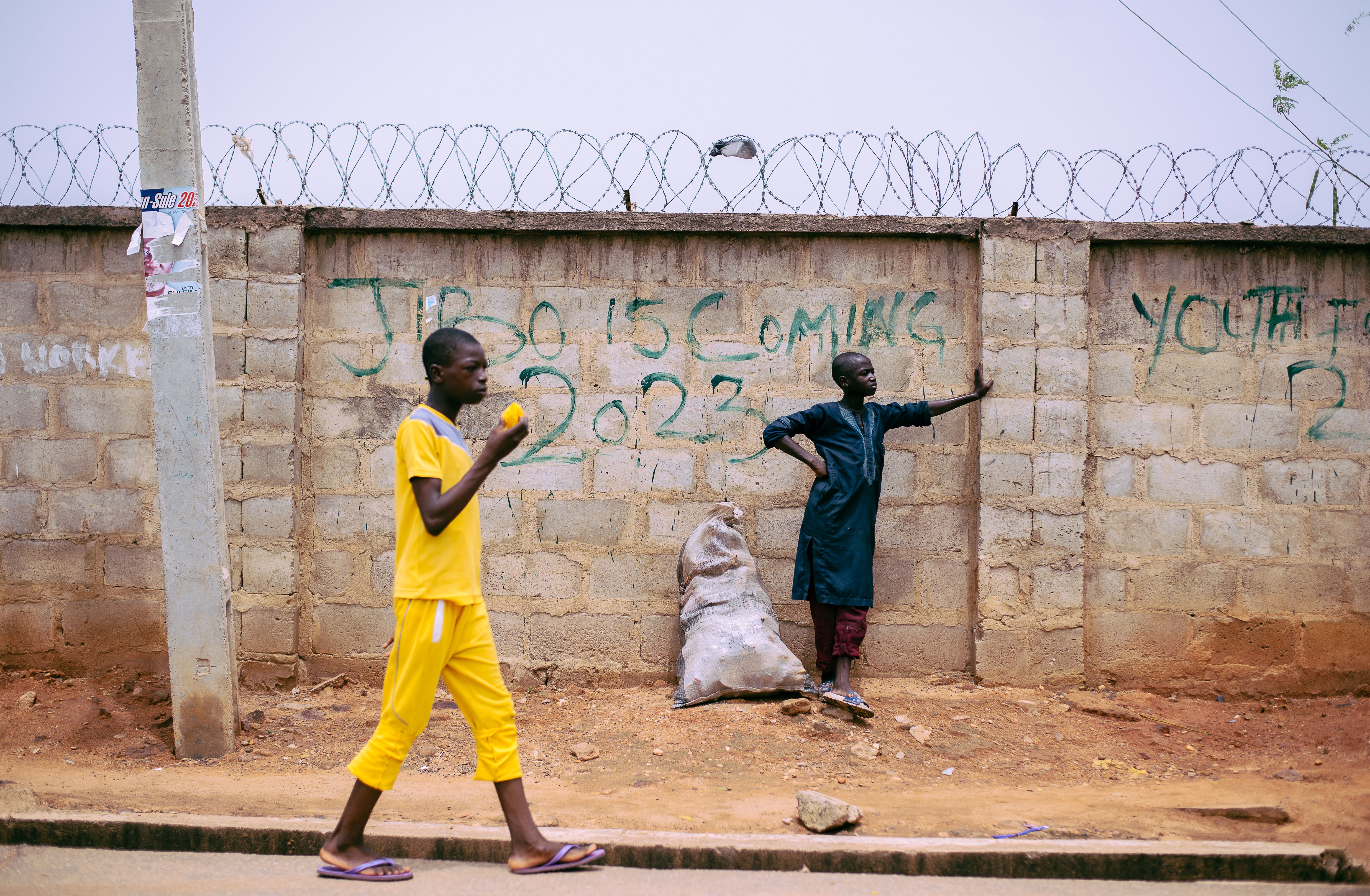 Street Scene with Graffiti and Two Young Men · Free Stock Photo