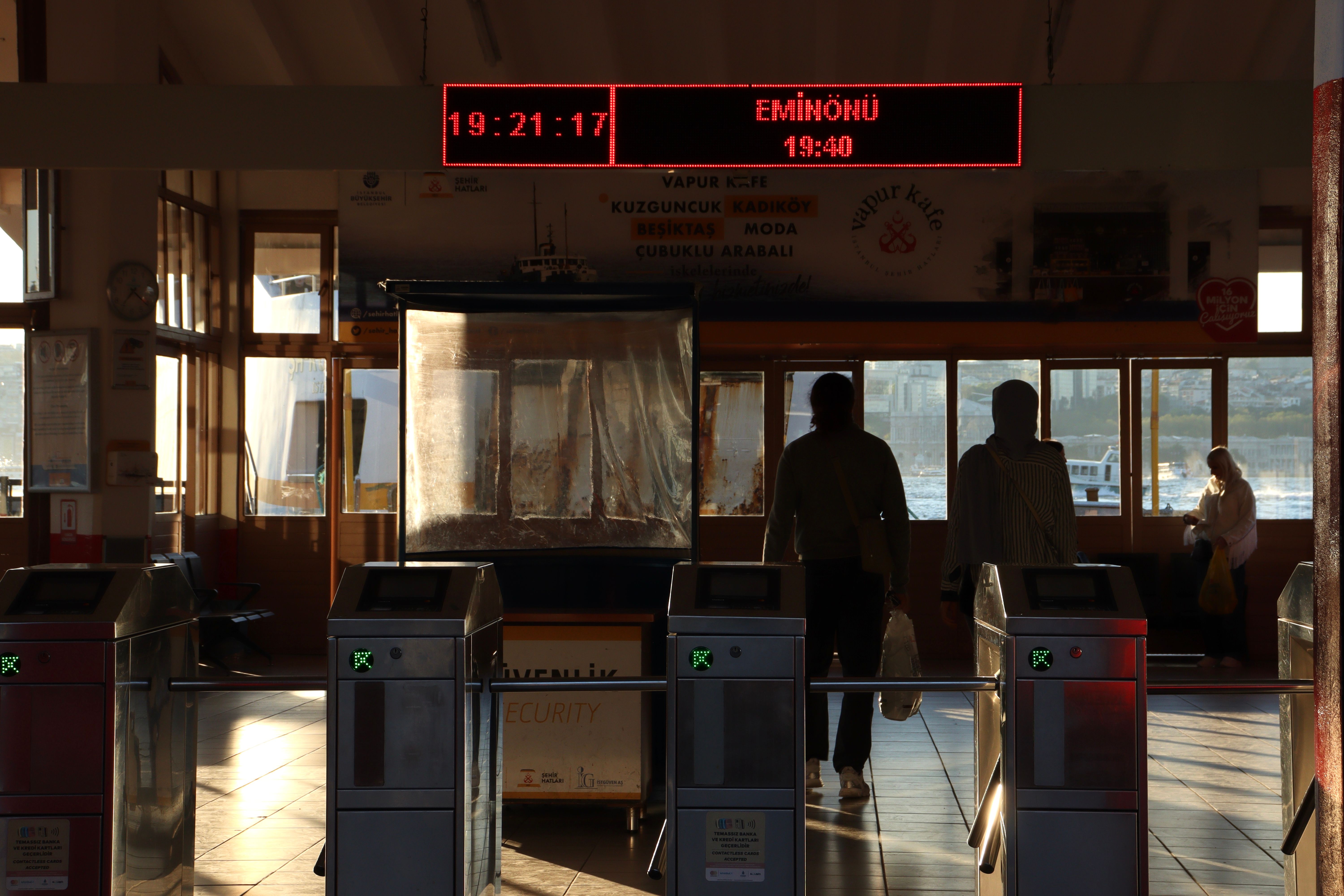 Silhouettes at a Ferry Terminal with Evening Light · Free Stock Photo