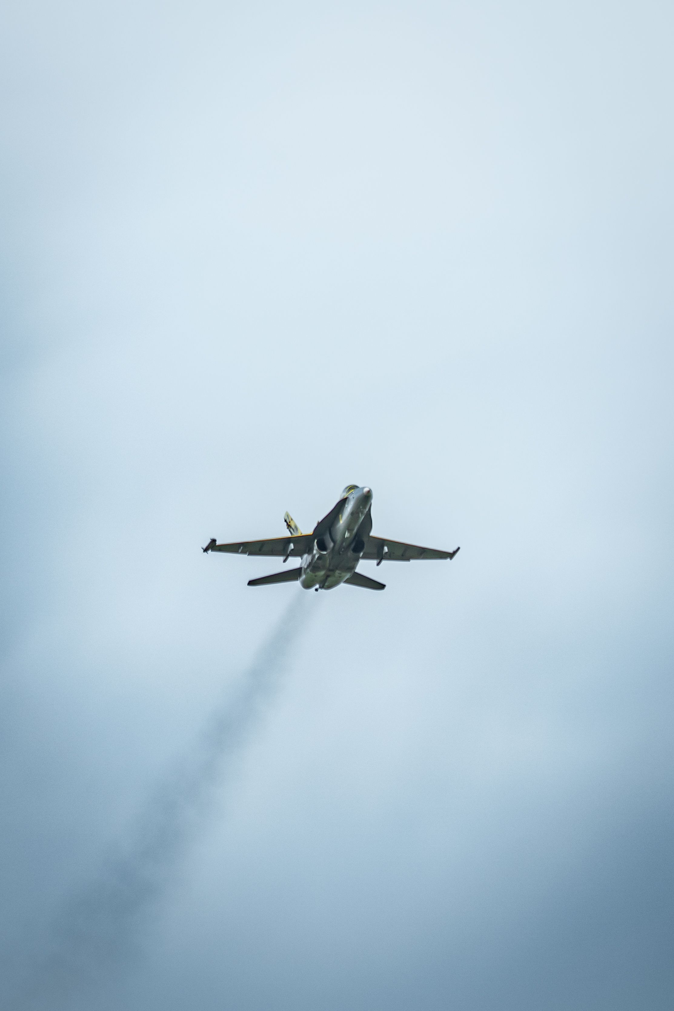 Jet Fighter Plane Soaring in Blue Sky · Free Stock Photo