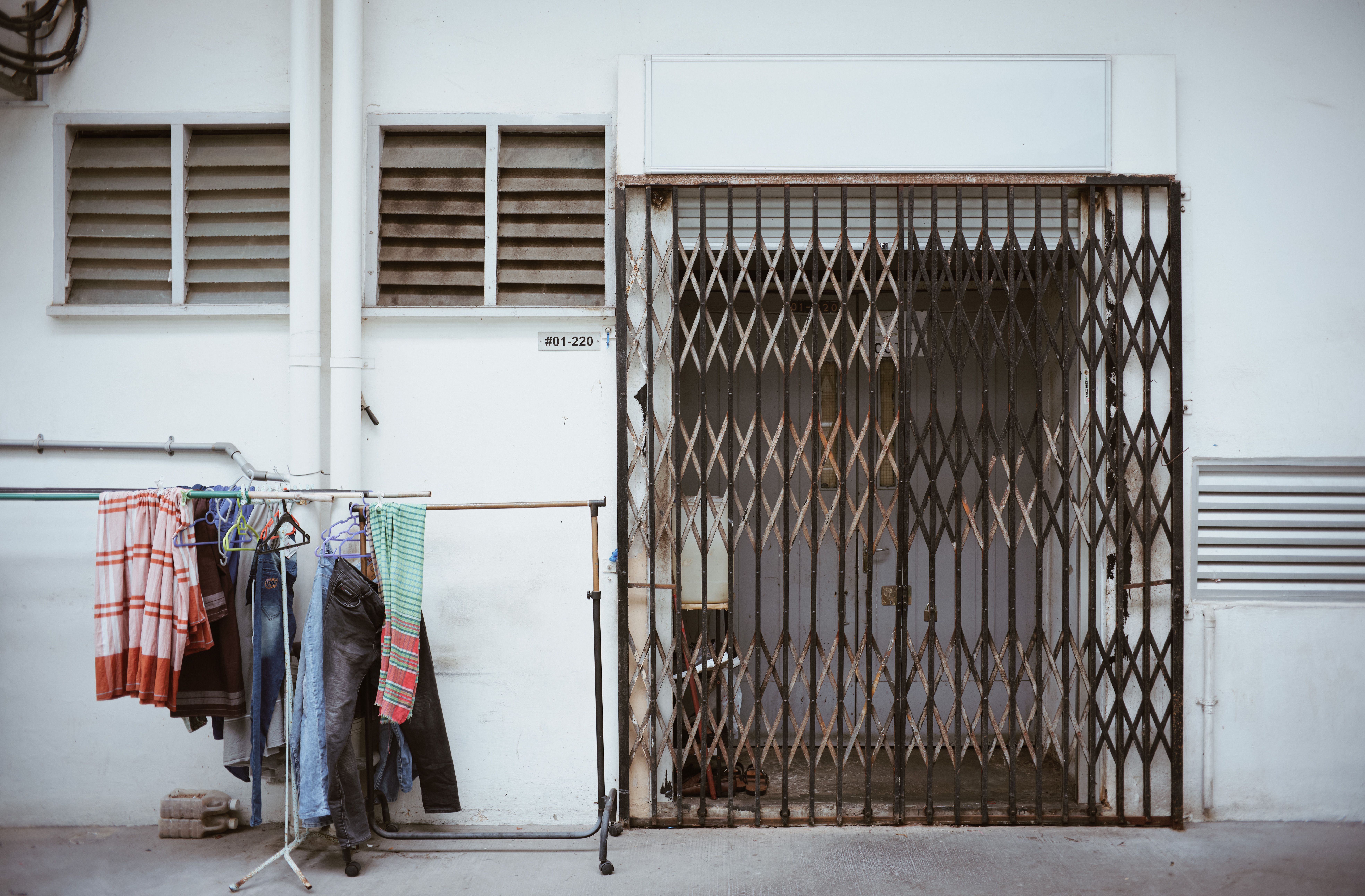 Urban Laundry Scene with Security Gate · Free Stock Photo