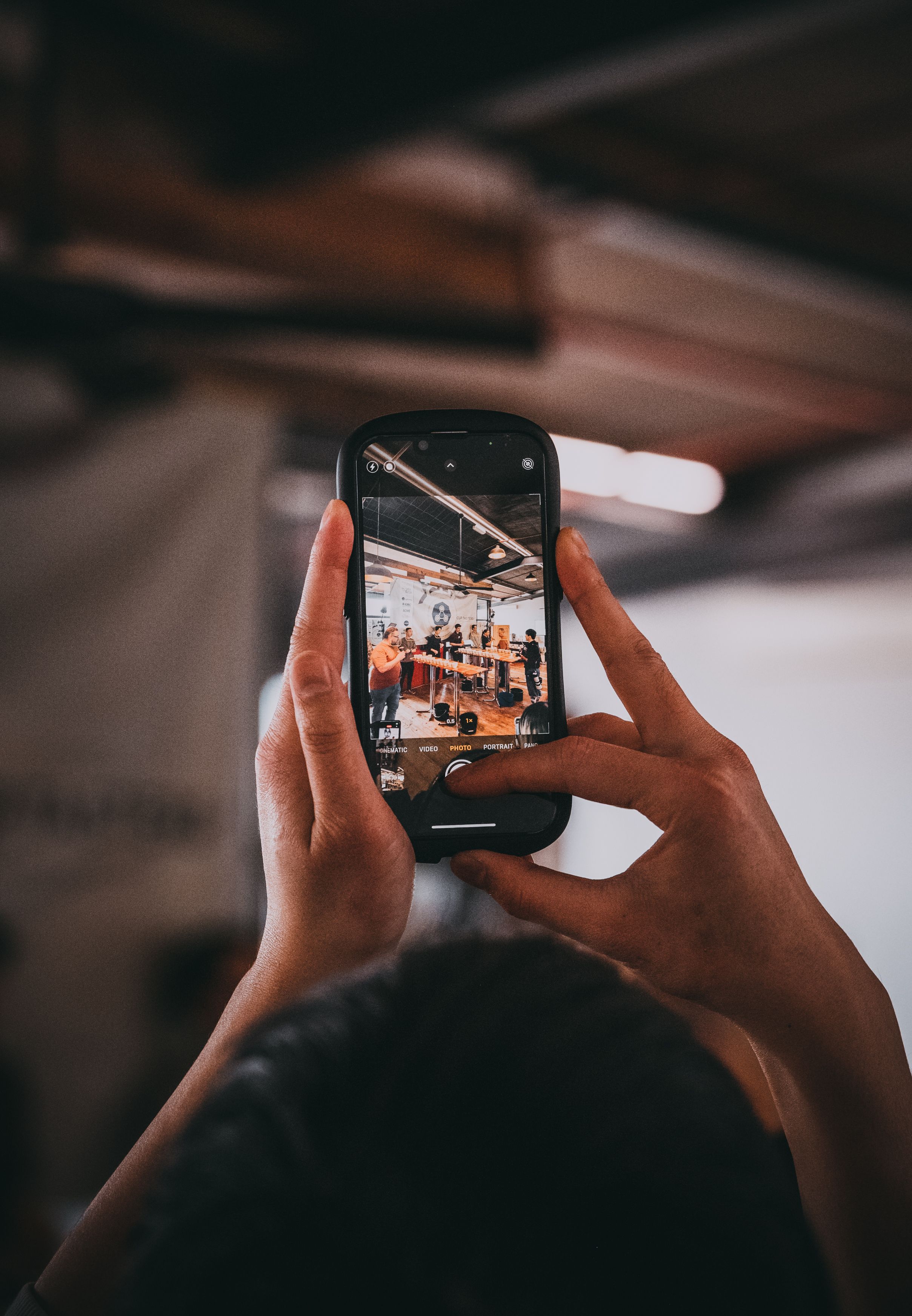 Capturing a Lively Indoor Event with Mobile Camera · Free Stock Photo