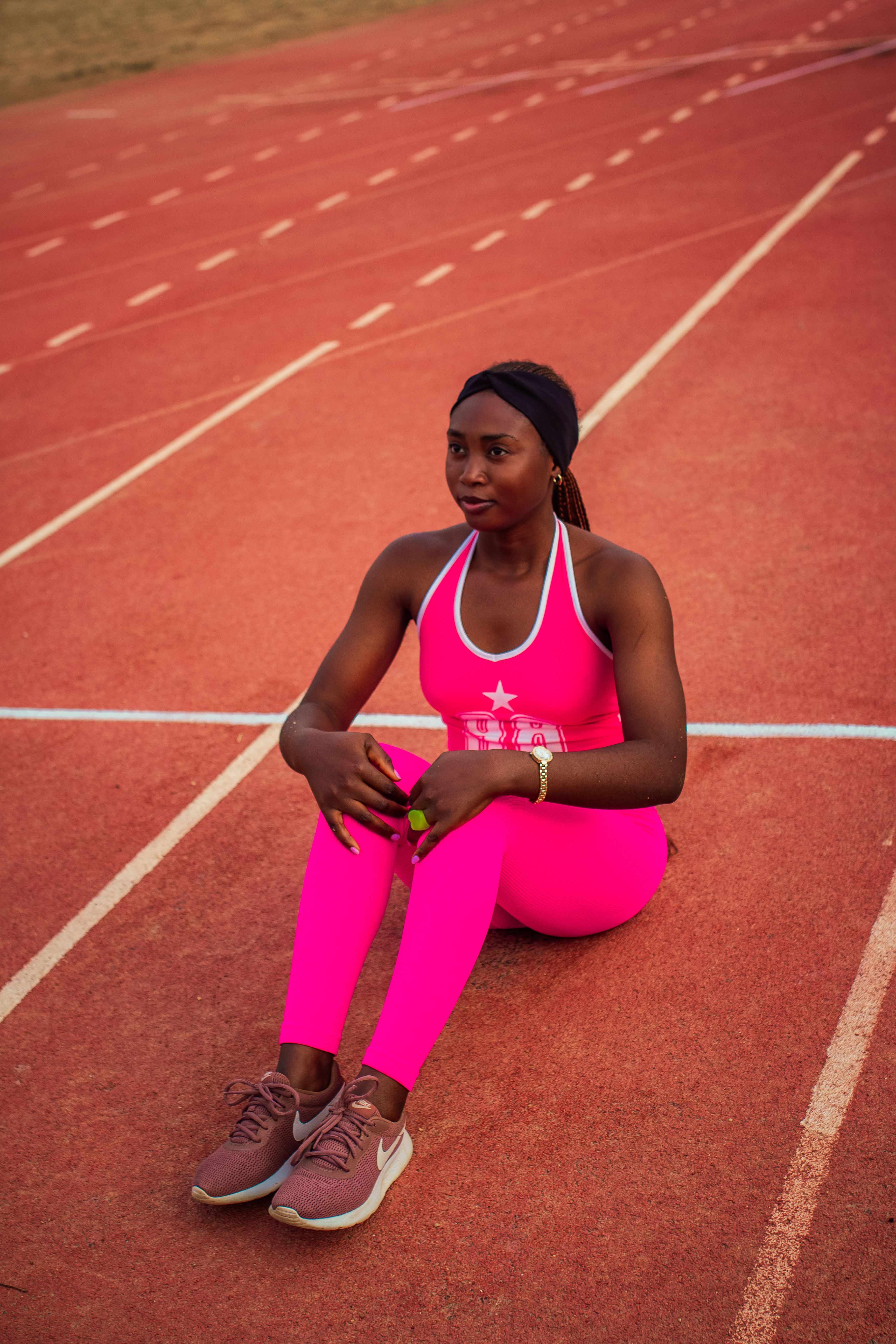Female Athlete in Pink on Running Track · Free Stock Photo