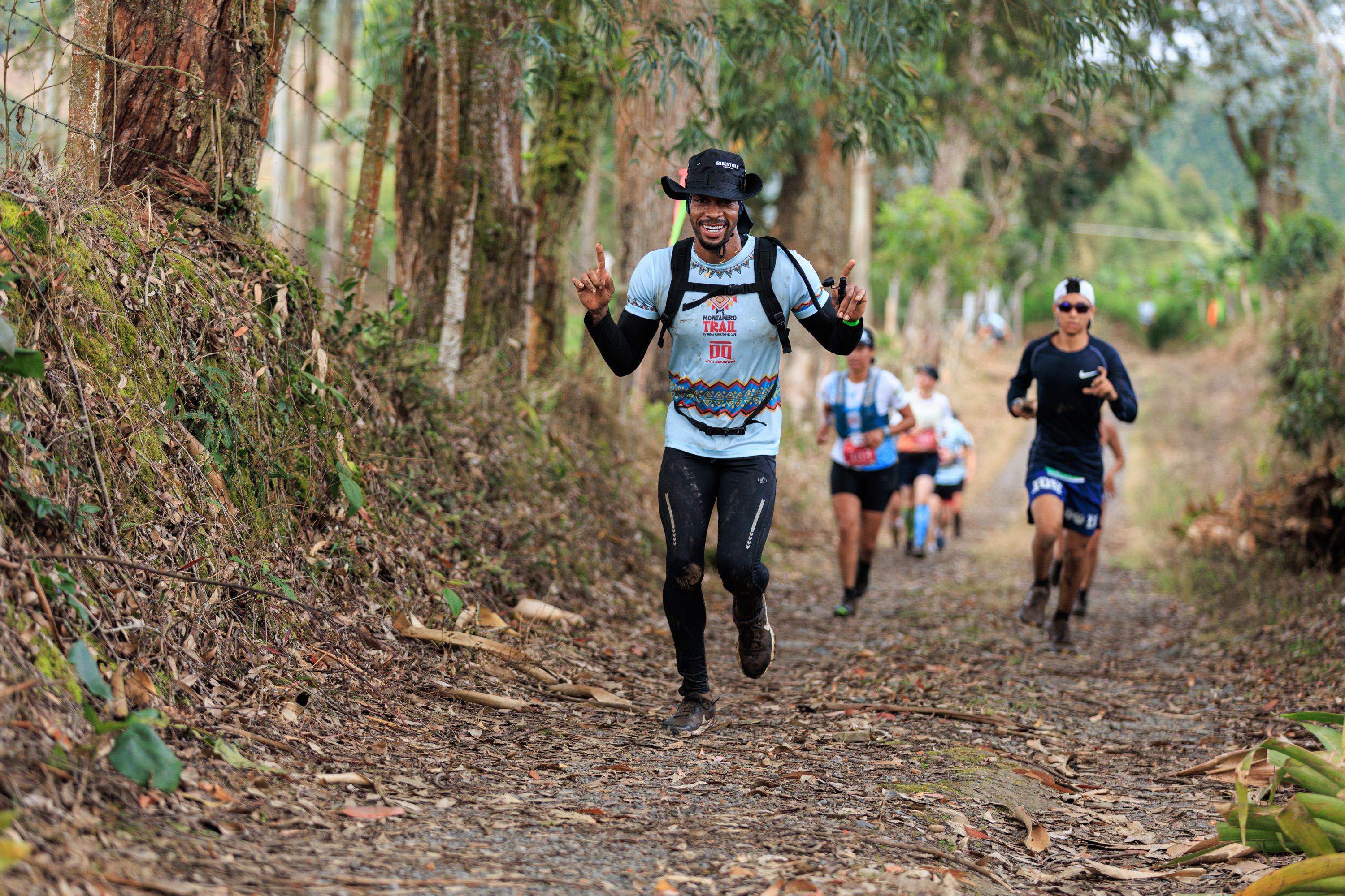 Trail runners enjoying a forest race · Free Stock Photo