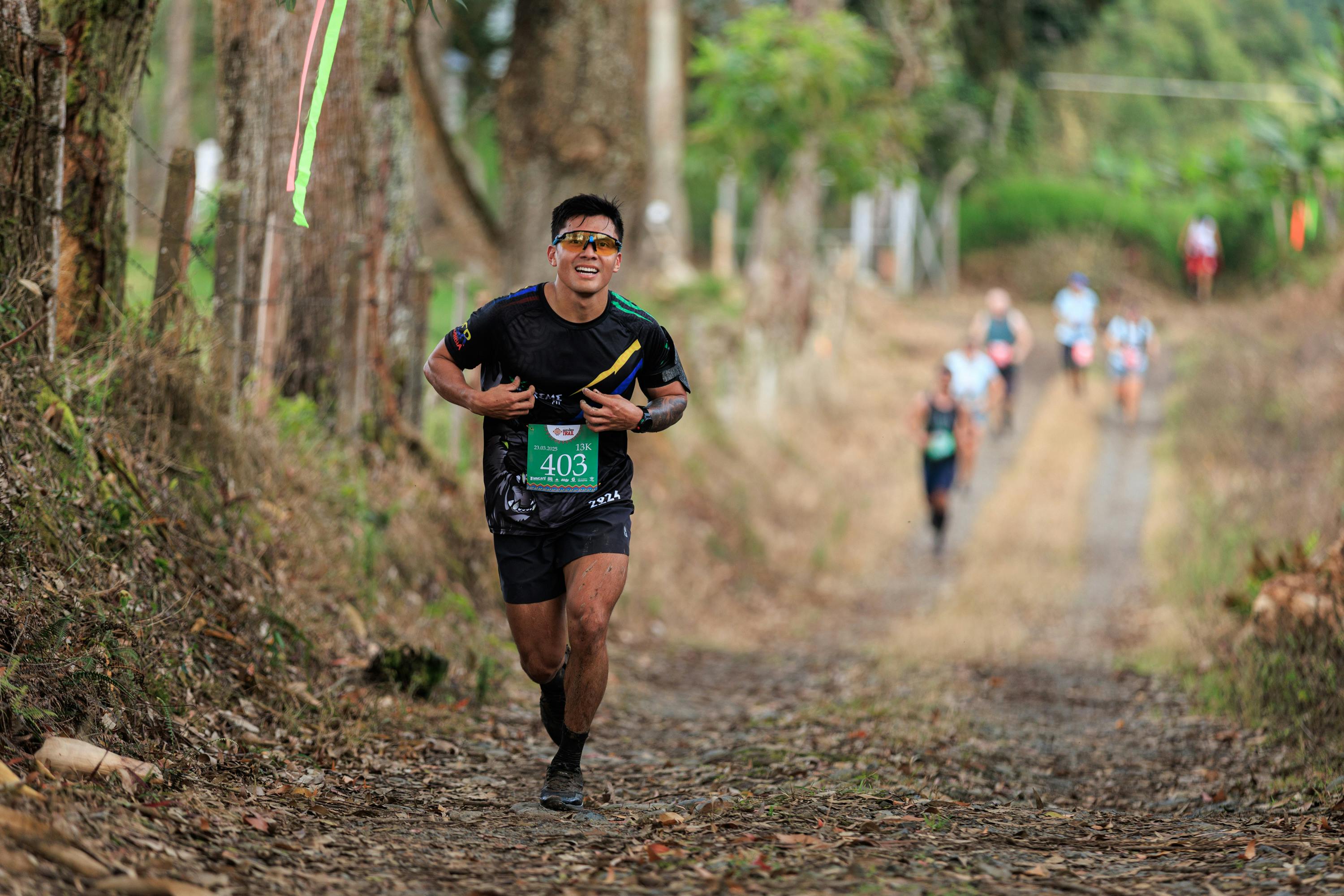 Trail Runner Pushing Limits in Forest Race · Free Stock Photo