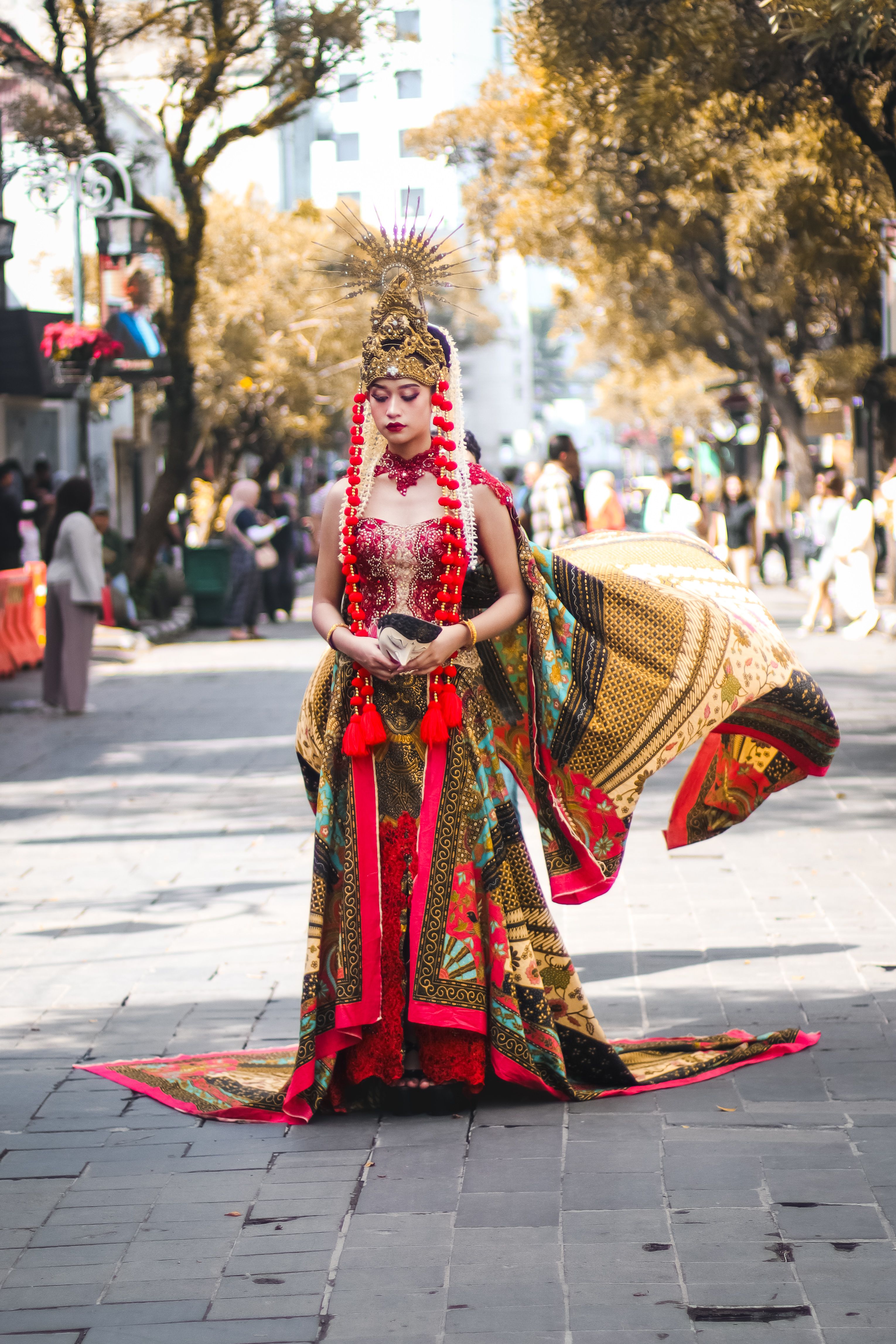Traditional Indonesian Costume on Busy Street · Free Stock Photo